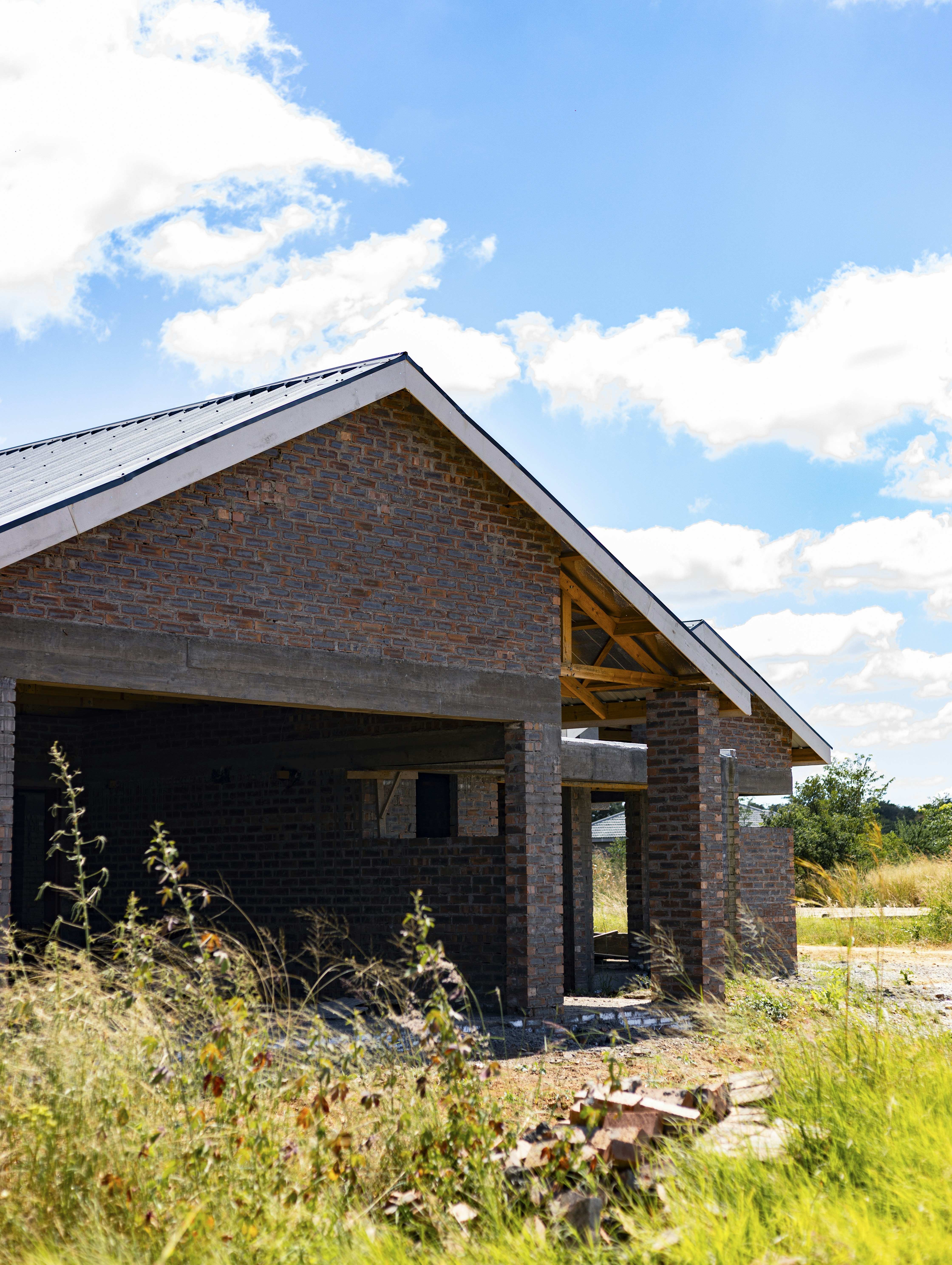 Abandoned Brick House Reaches Toward a Clear Sky