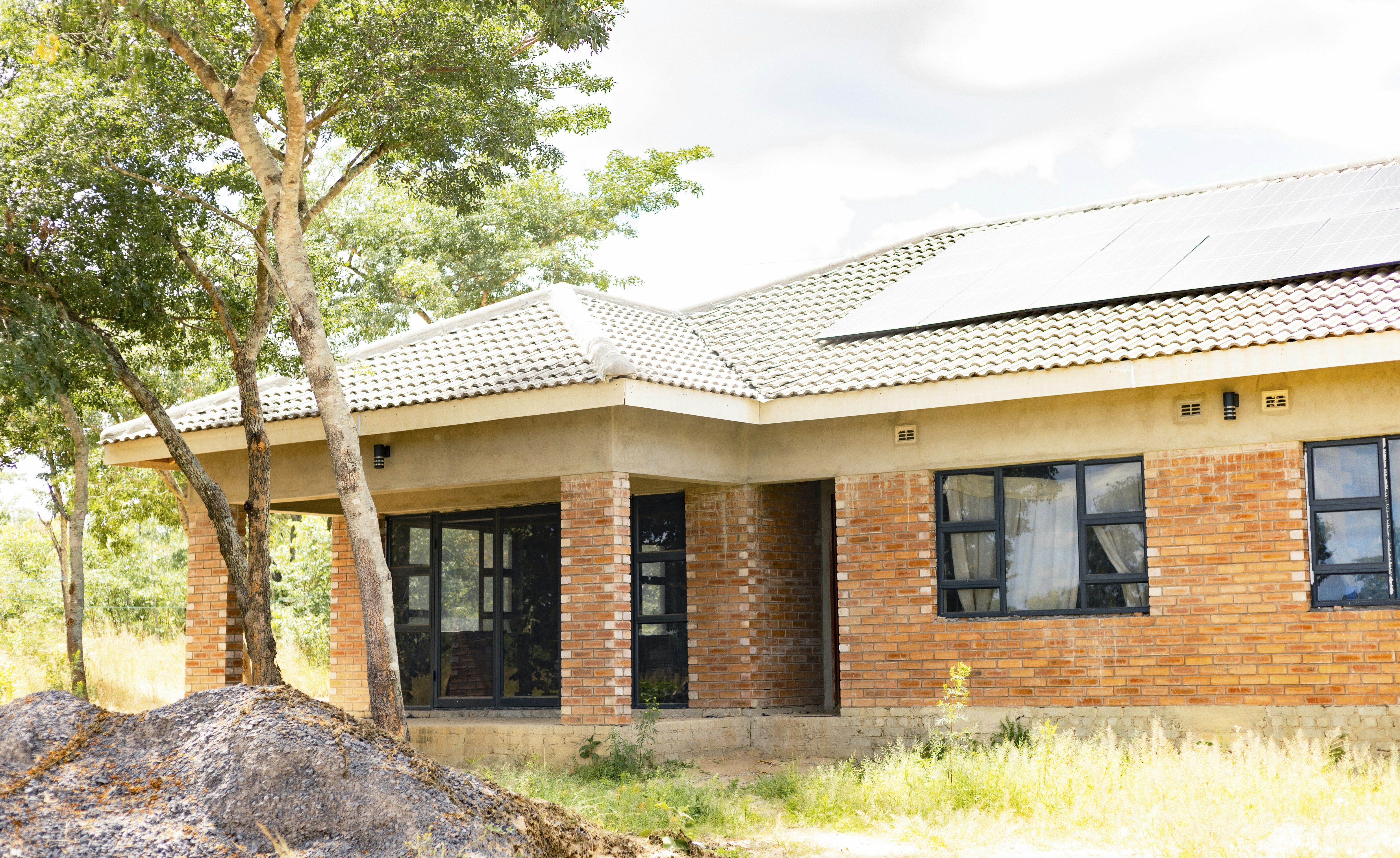 Brick House Under Solar-Tilled Sky