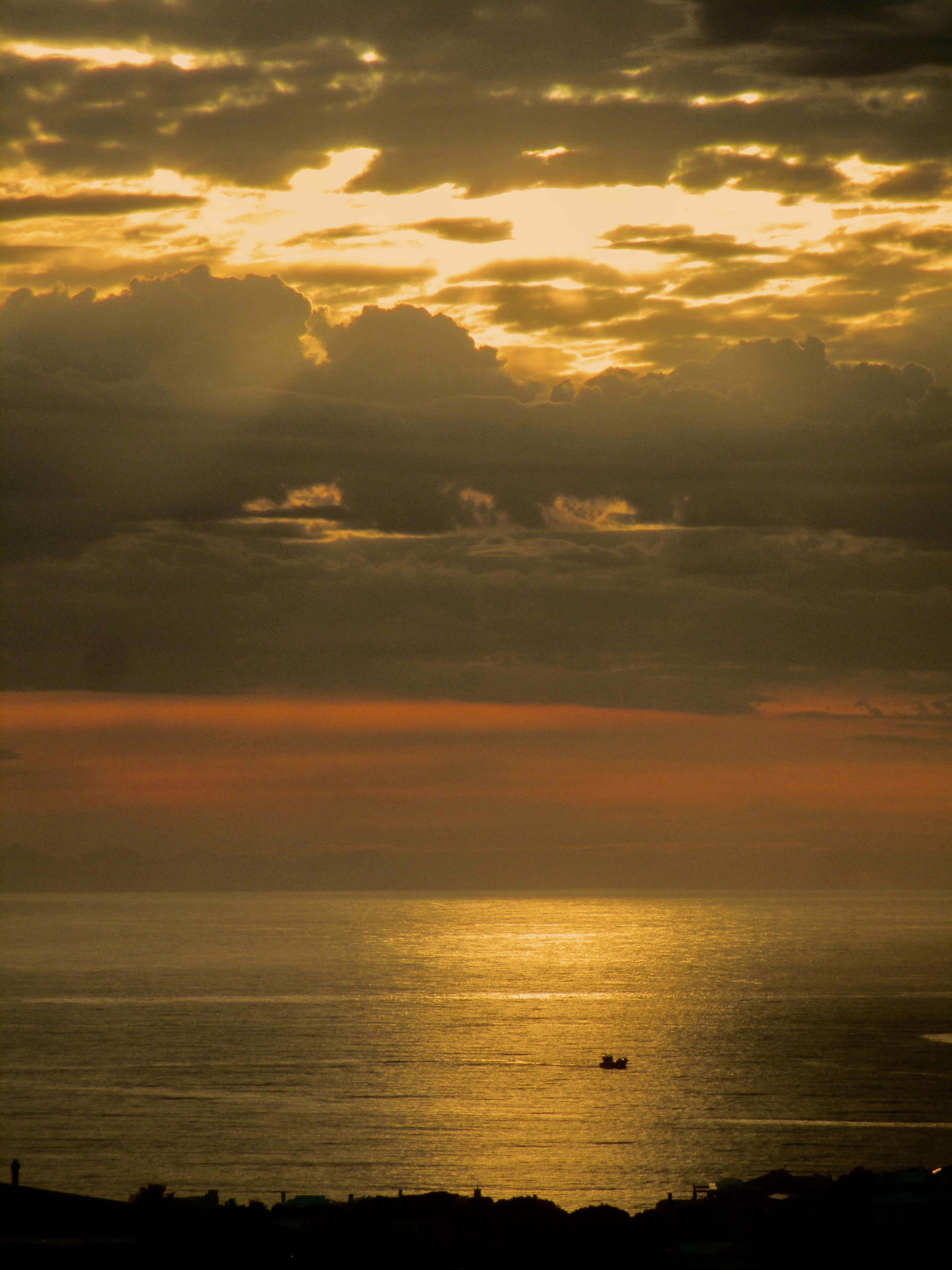 Golden Path: Sunset Light Splaying Across a Quiet Sea