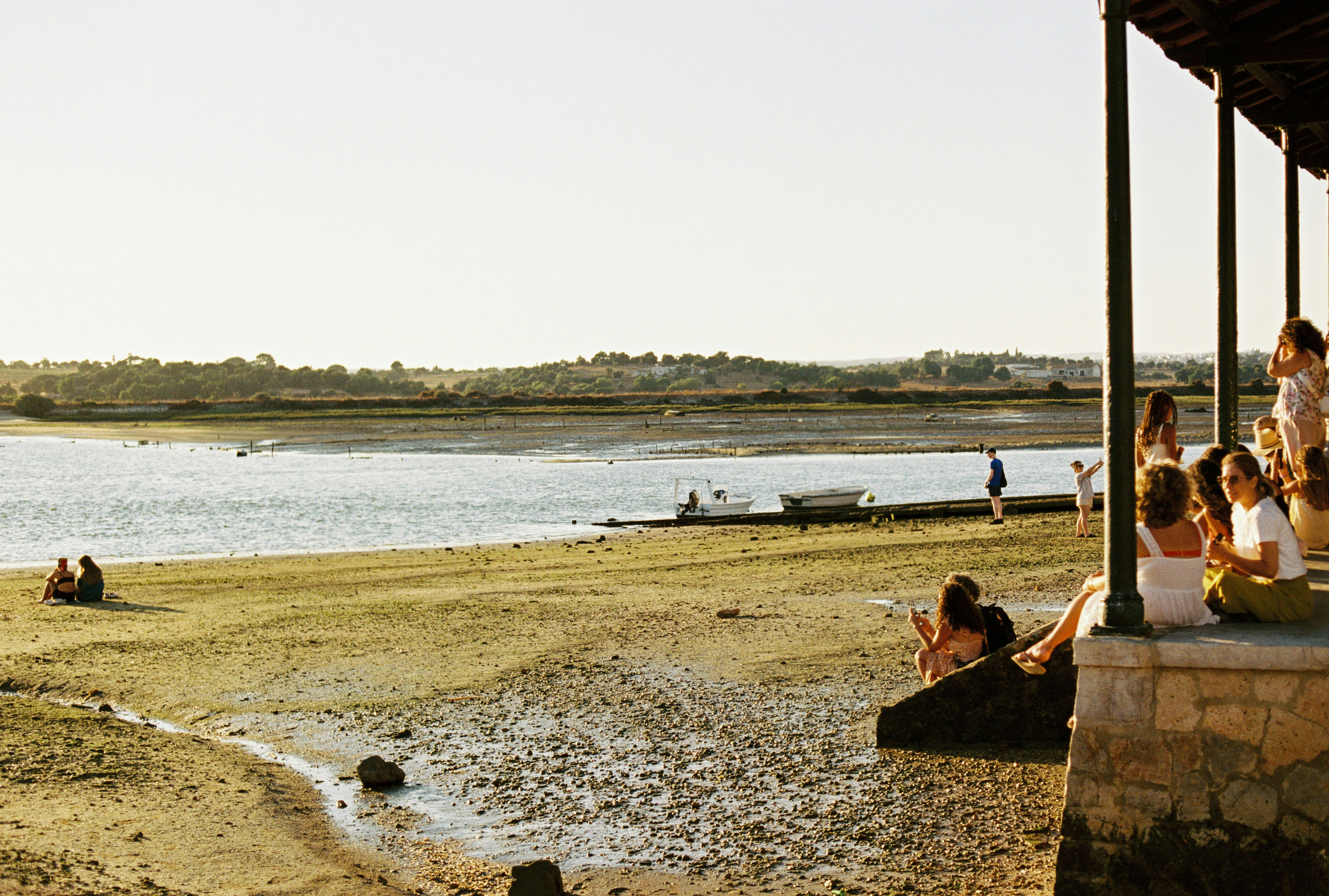 Shoreline Portrait: A Quiet Gathering on a Riverside Terrace