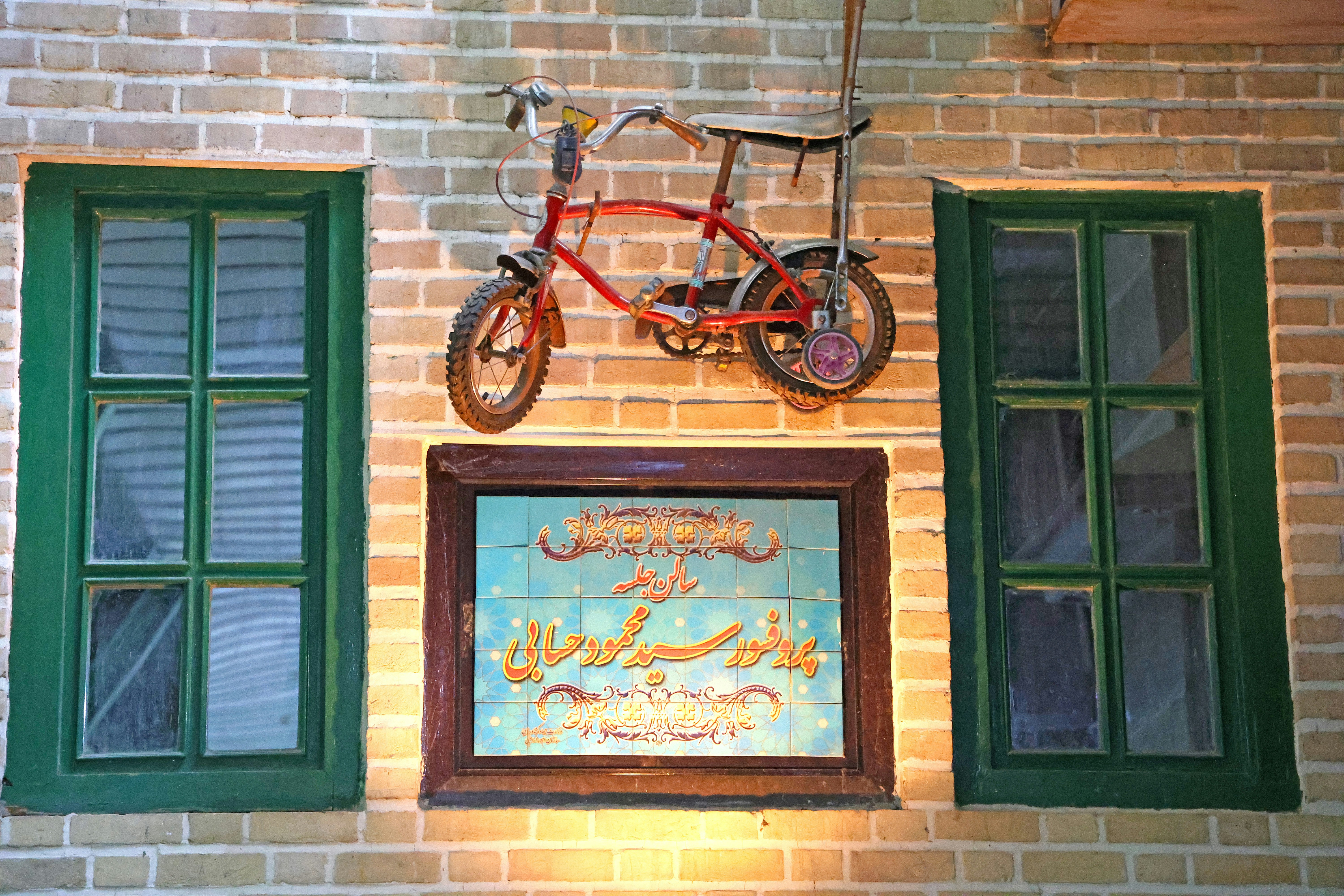 Winged Ride Above the Brick: A Quirky Baroque of Green Shutters