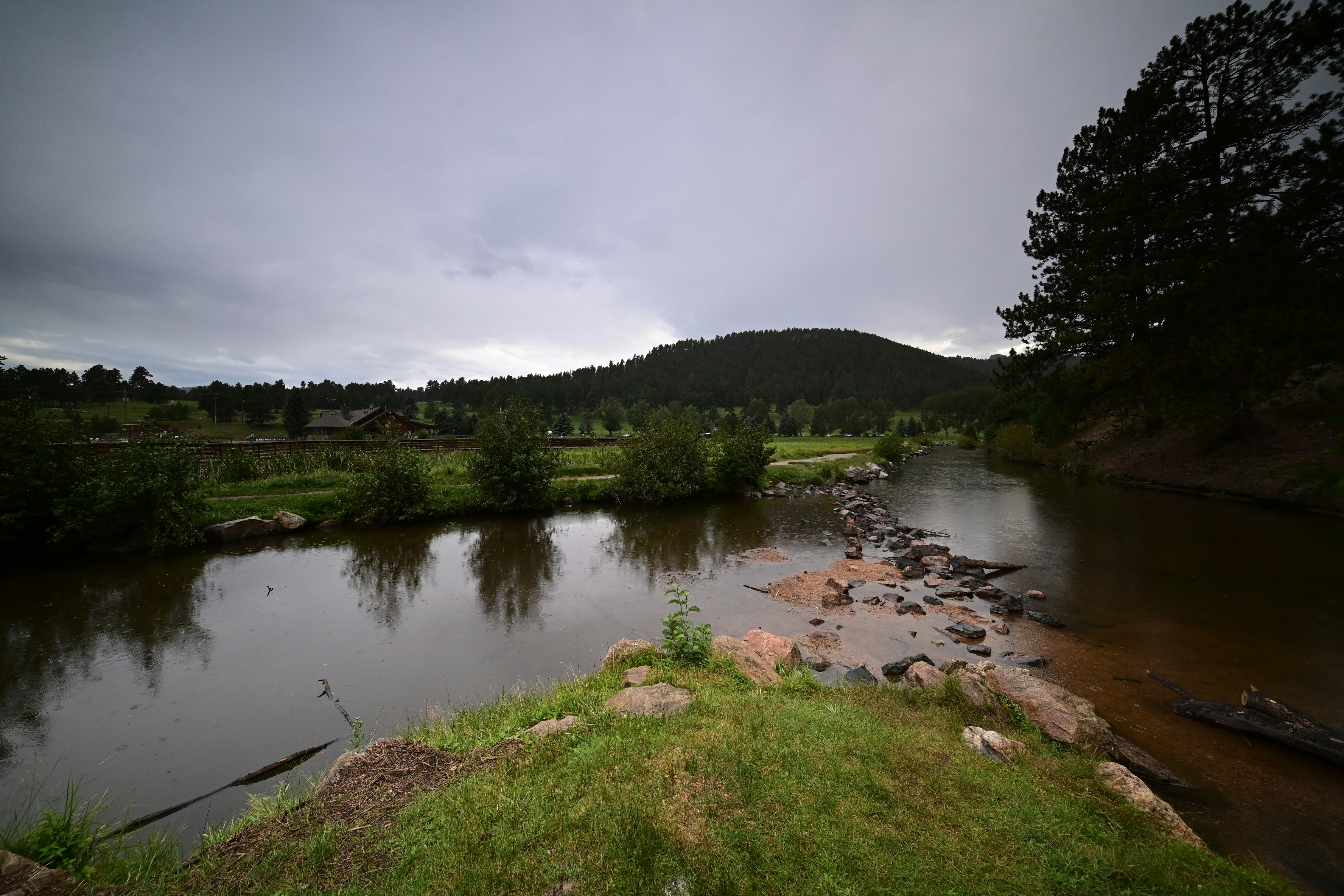 Riverside Crossing Under a Quiet, Cloudy Sky