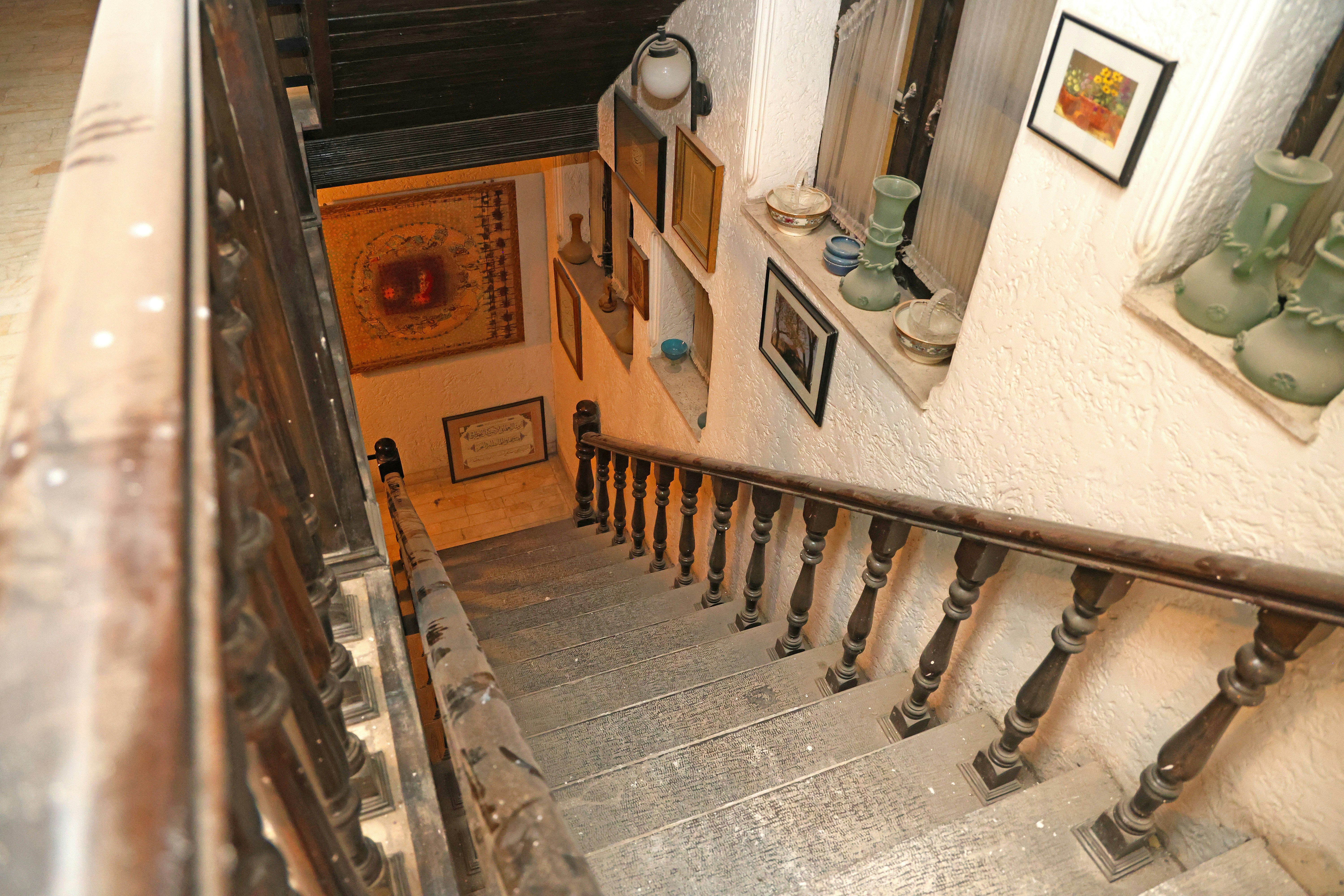 A Timeworn Staircase: Vintage Decor Lines the Descent
