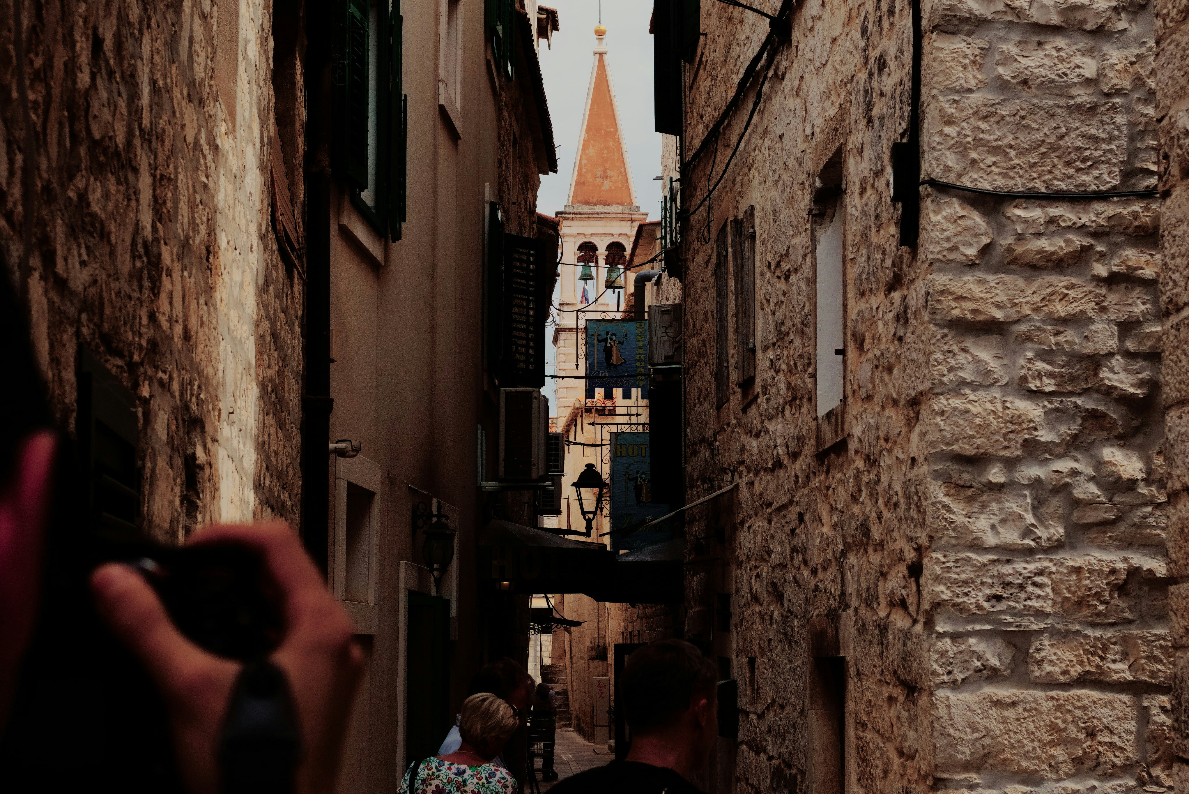 Shaft of Light: A Sunlit Staircase Pierces a Medieval Alley