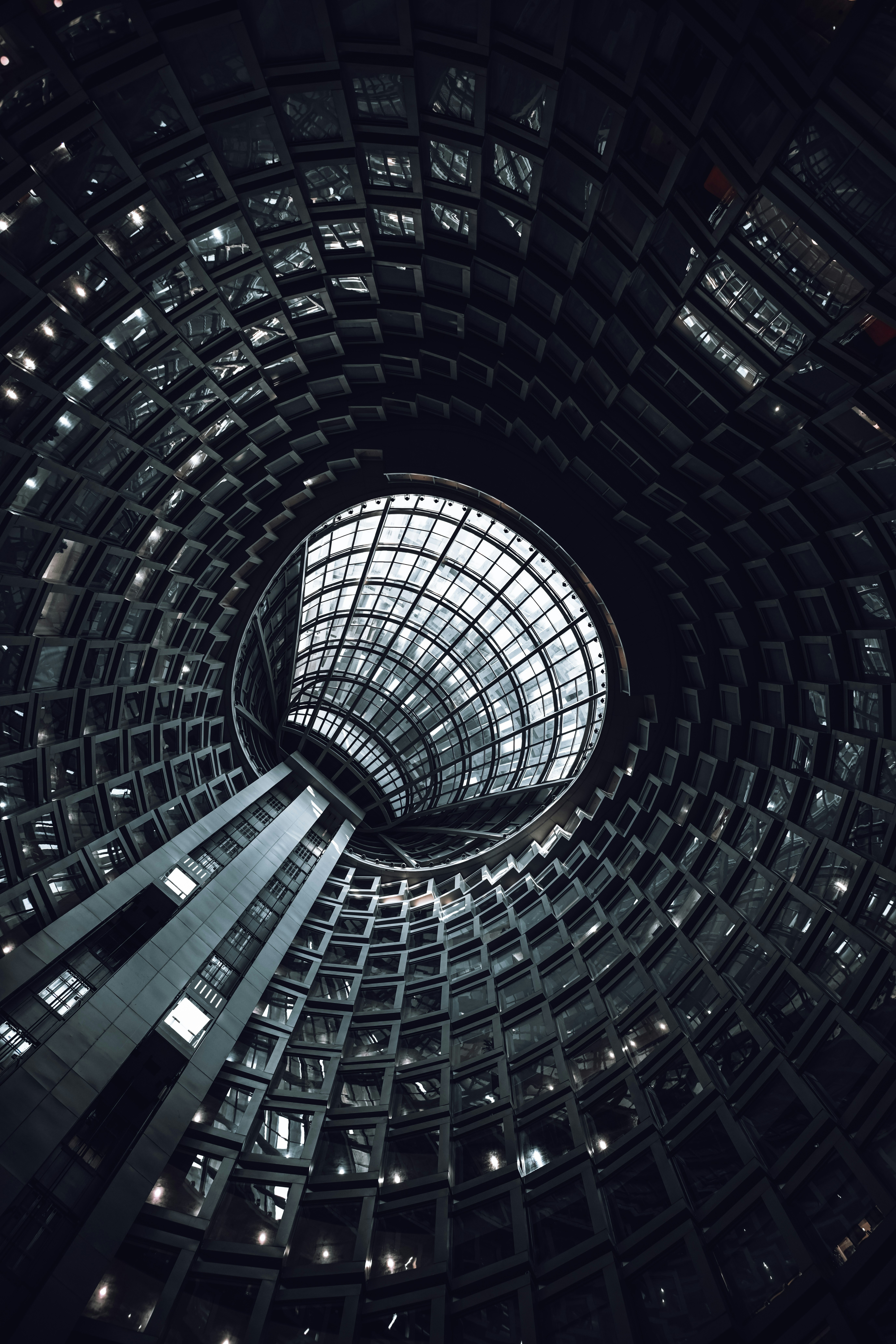 Circular Atrium Aglow: A Spiral of Windows and Glass