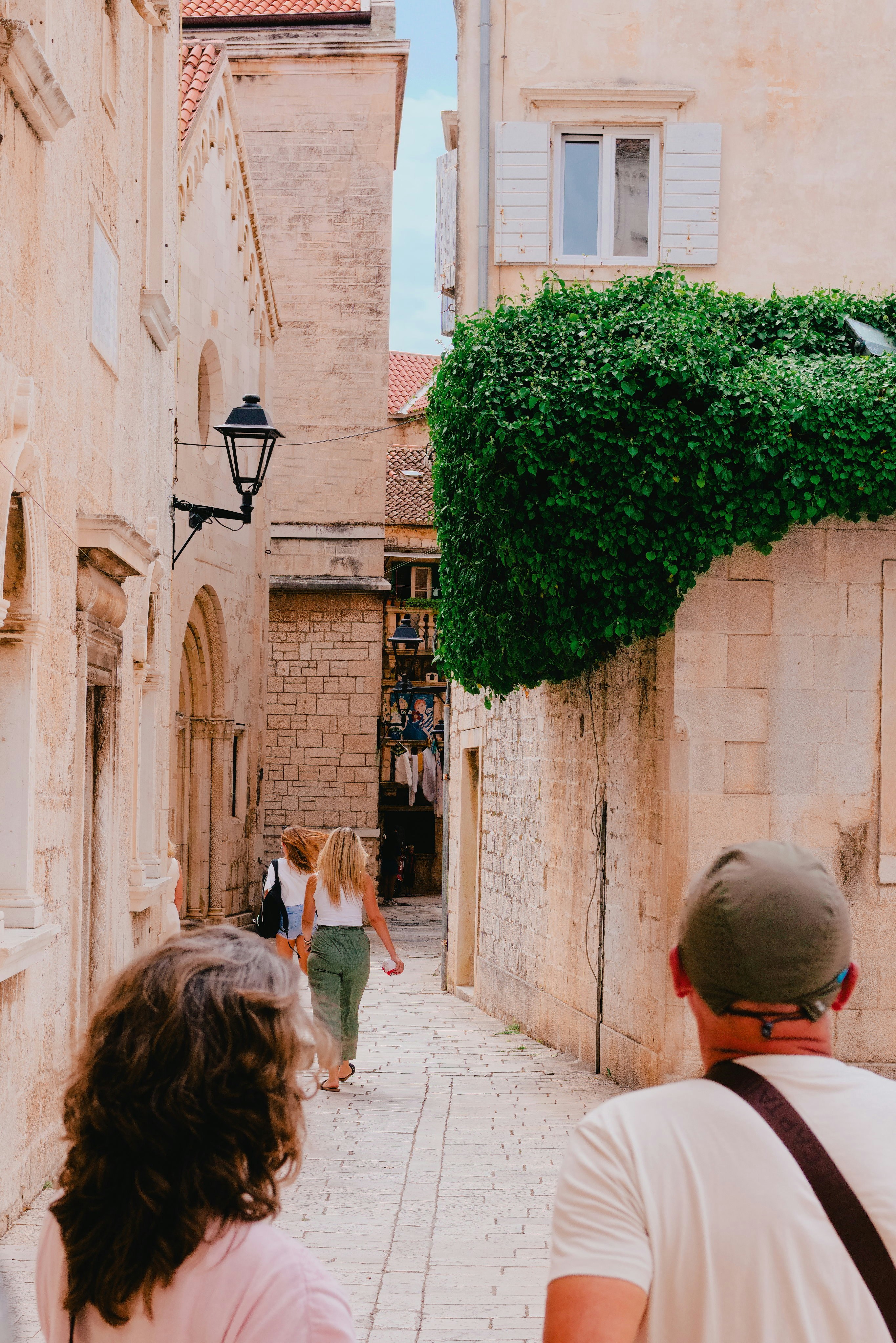 Pastel Stroll Through a Sunlit Mediterranean Alley