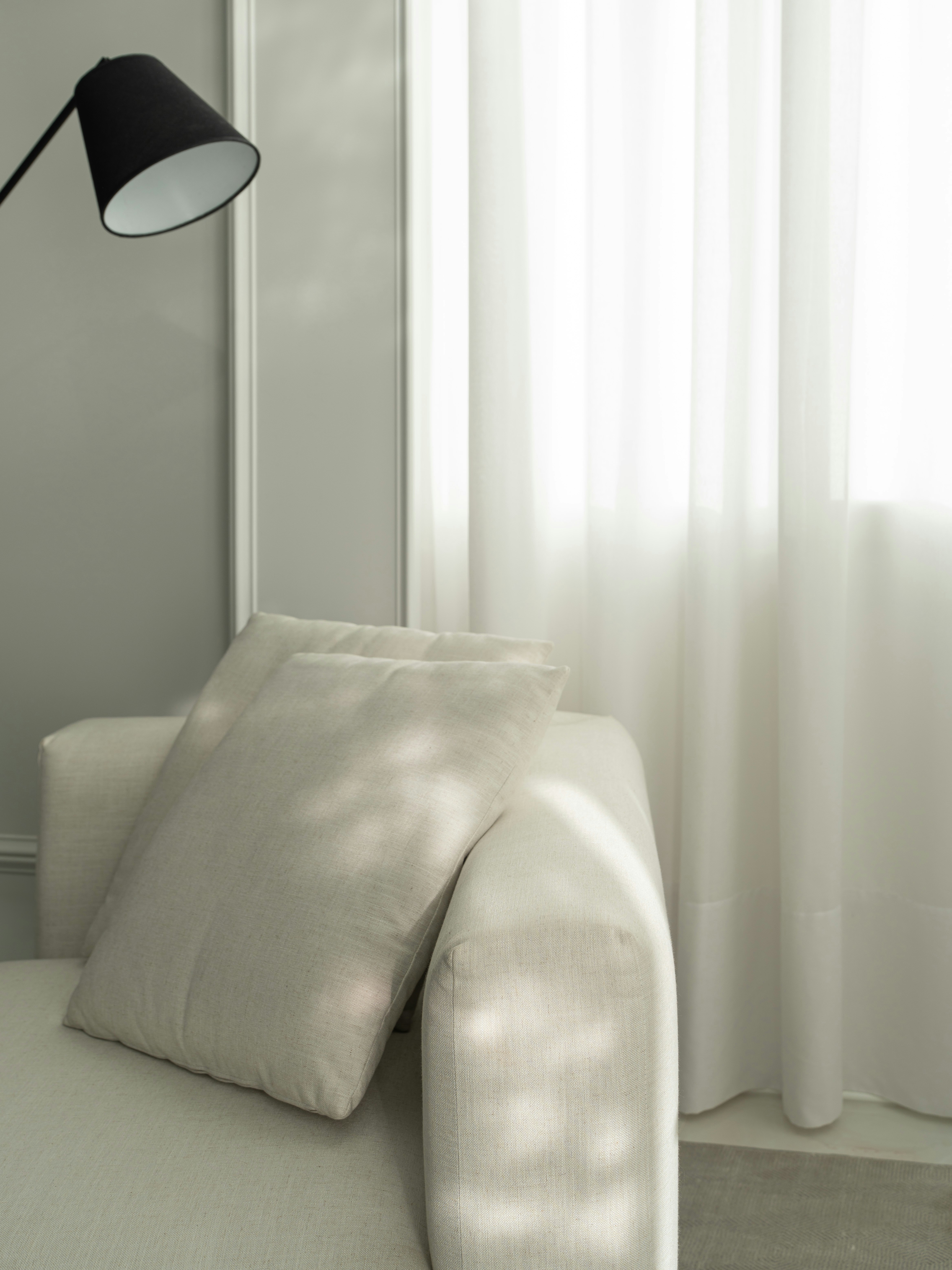 Minimalist Sanctuary: Soft Light and Quiet Comfort in a Neutral Corner