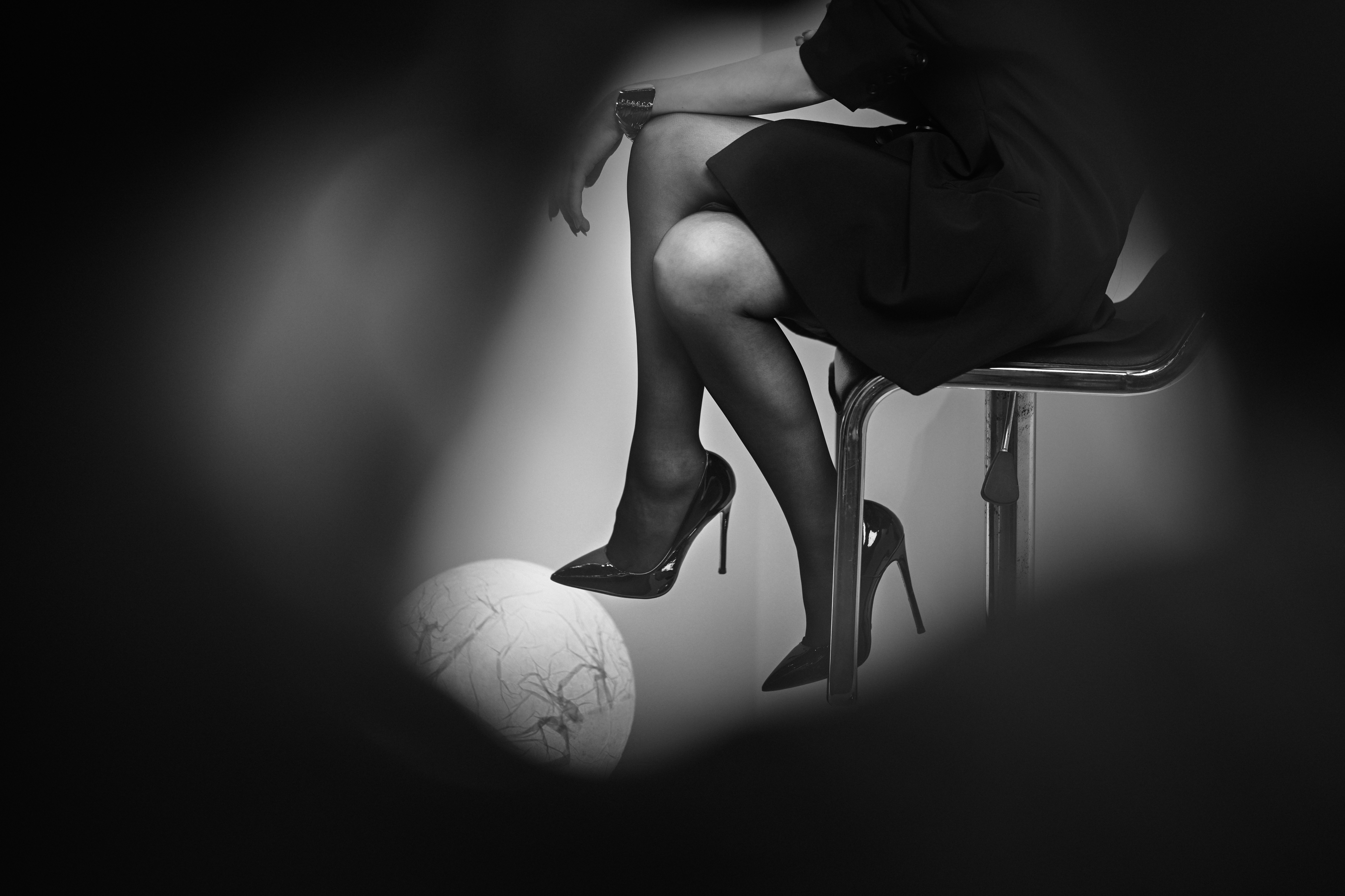 Silhouette of Style: A Legged Poise under Spotlight
