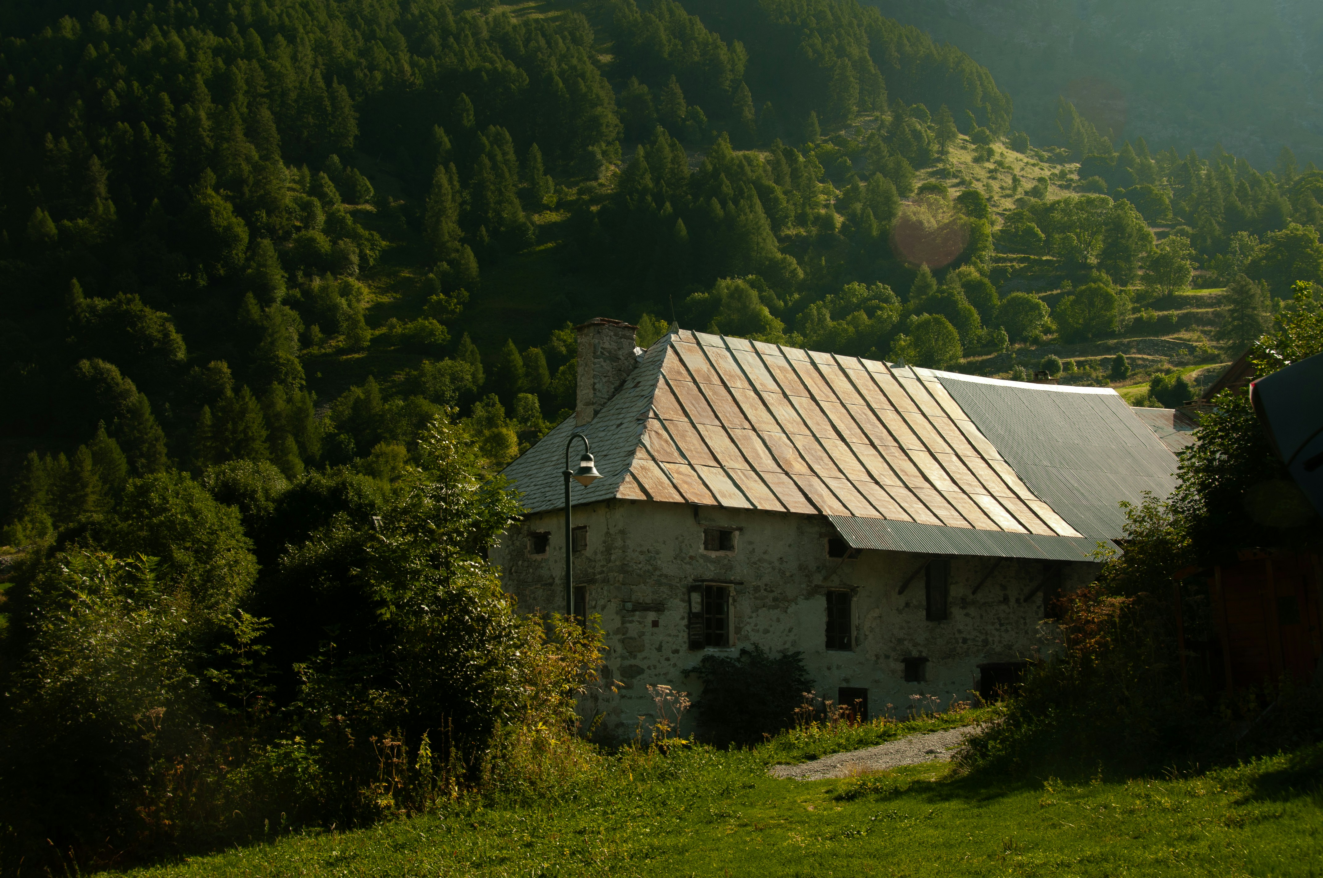 Rustic Chalet Amid Green Slopes at Golden Hour