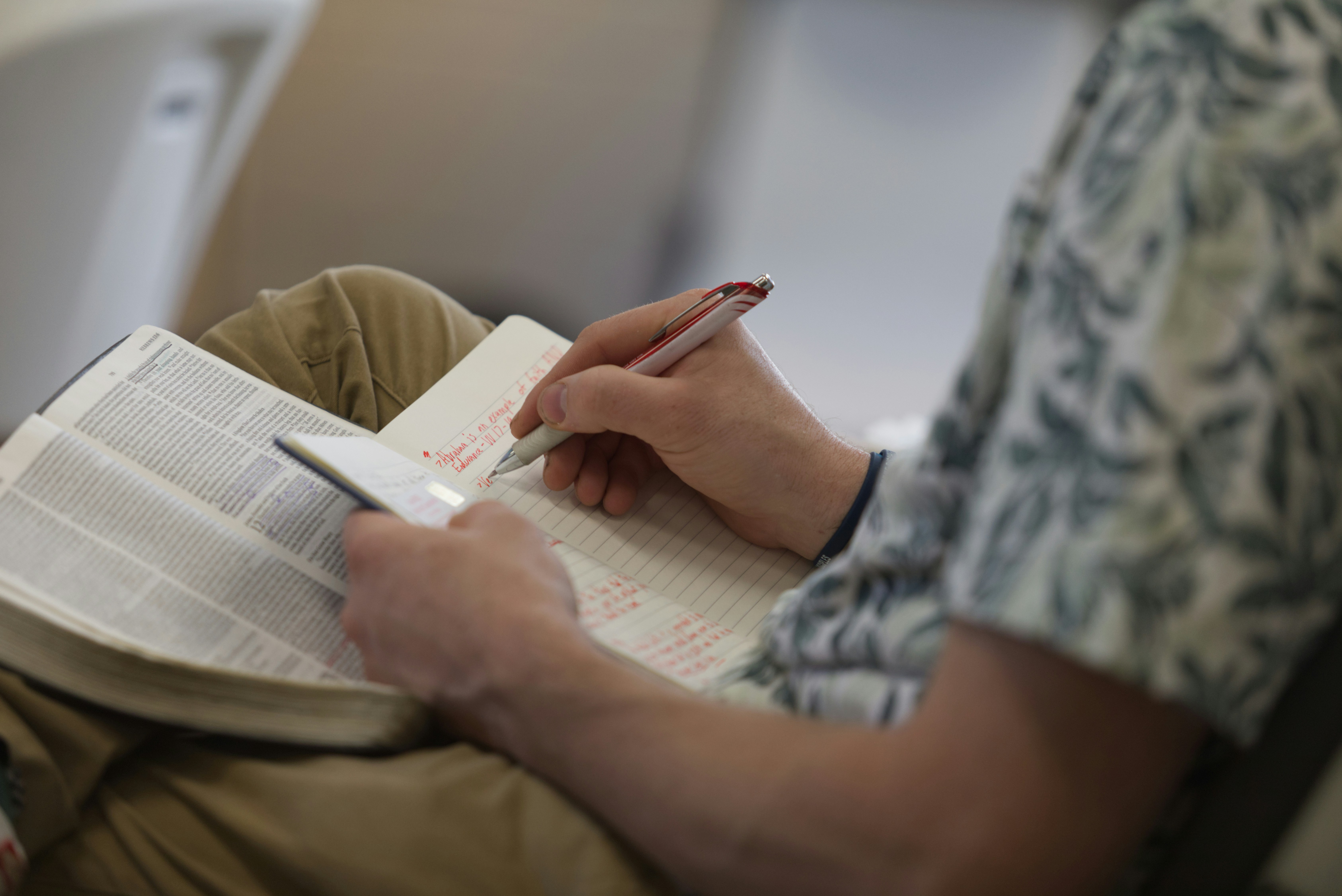 Pen in Hand over Open Bible: Quiet Study Moment on a Lifelike Afternoon