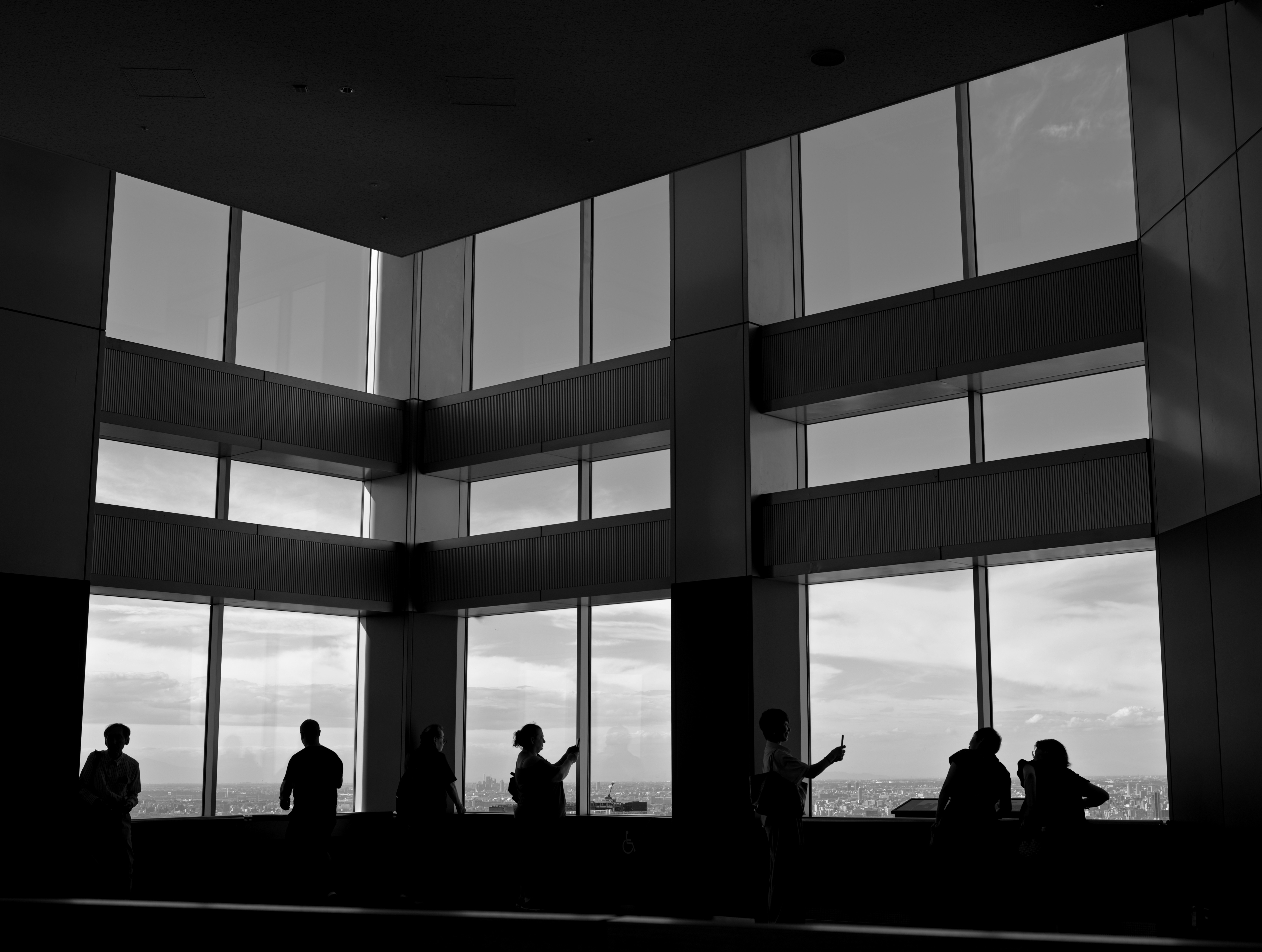 Silhouettes in a Sunlit Atrium