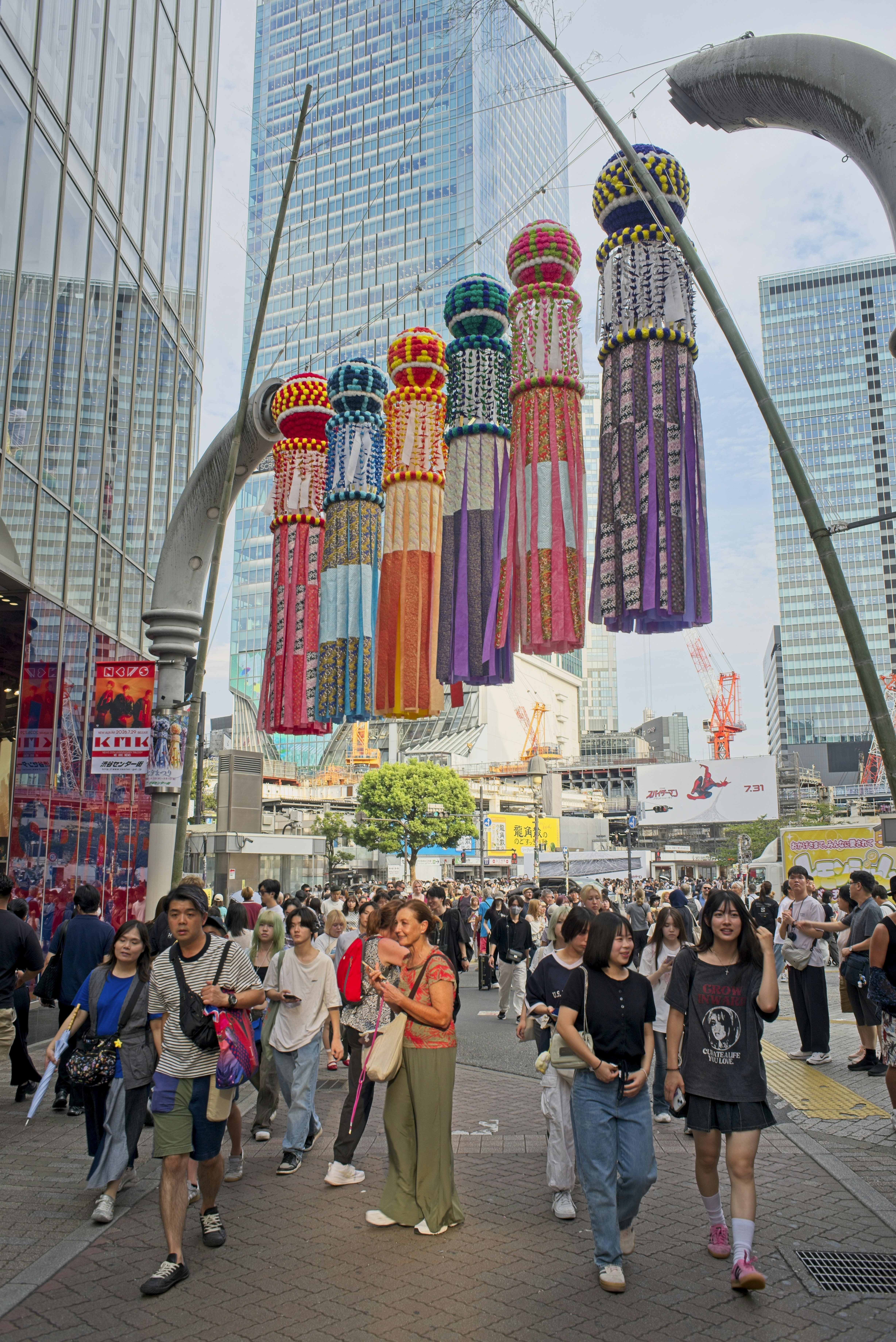 Floating Lanterns Over a Bustling City Plaza