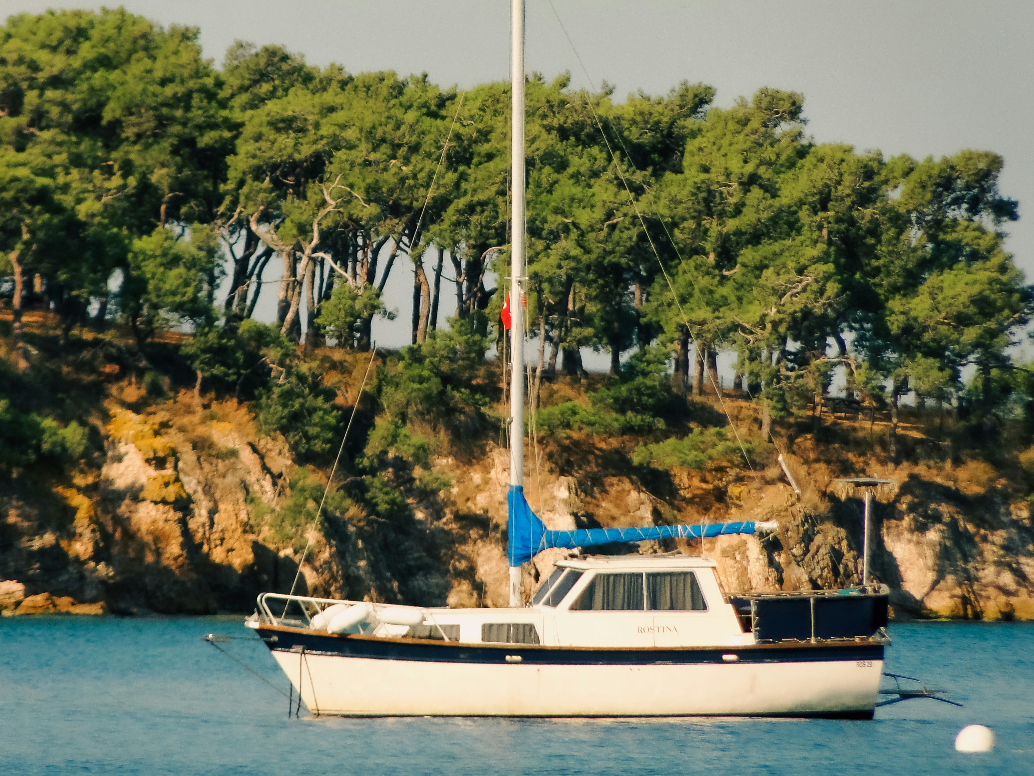 Capri Sailboat Resting Against Emerald Isles