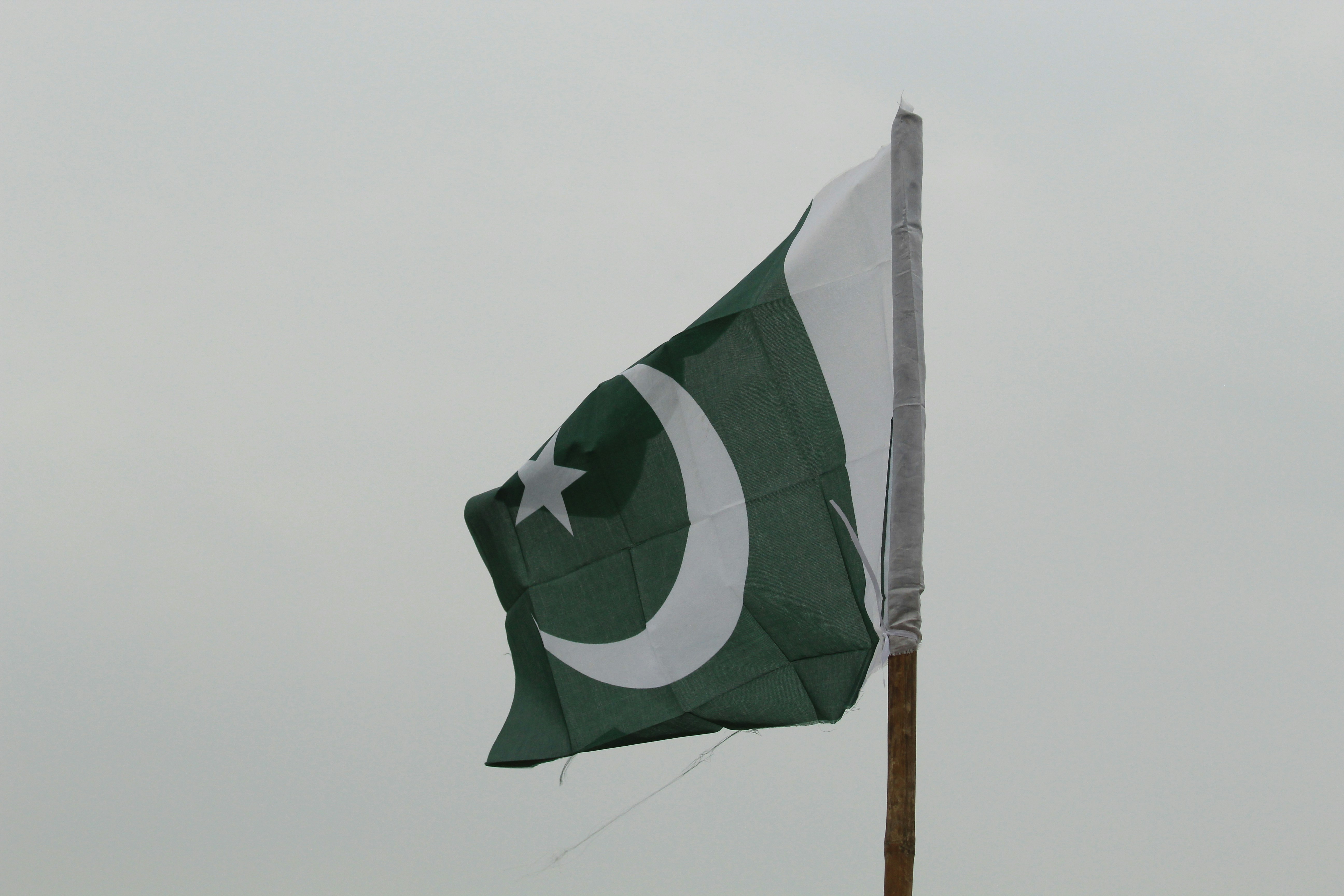 Flag on the Wind: Pakistan's Crescent and Star in a Quiet Sky