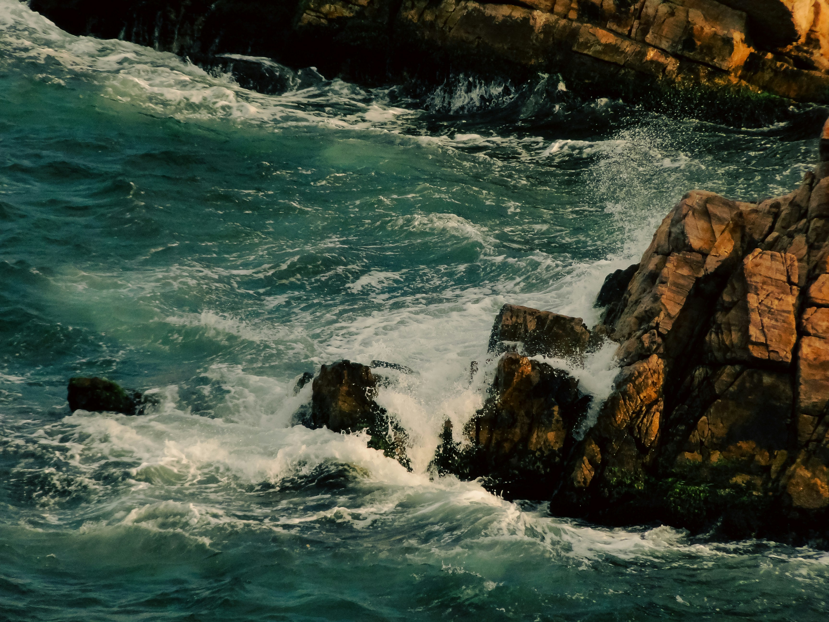 Sunlit Alpenglow on Rugged Coastline