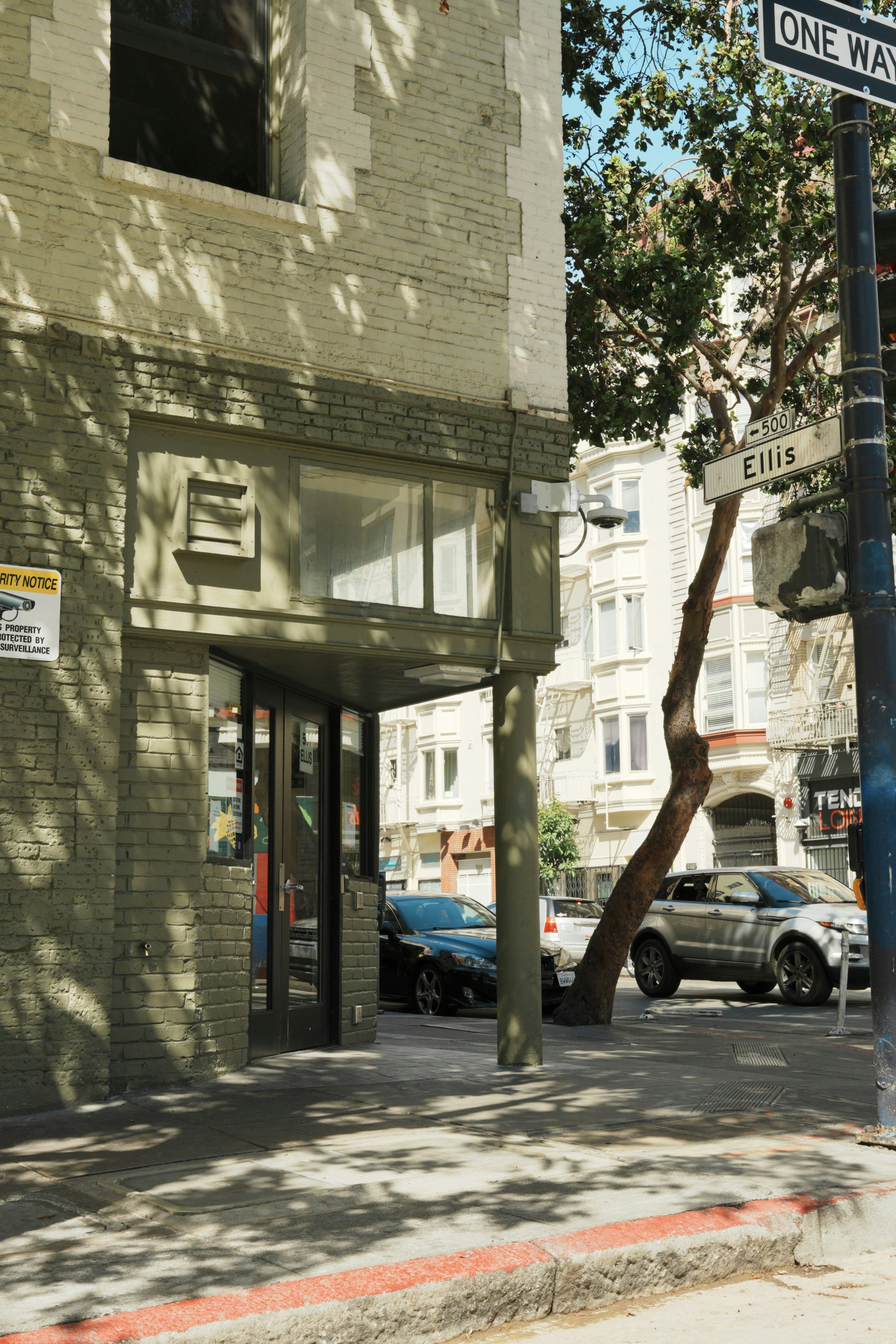 Corner of Light and Shadow: Urban Corner Storefront