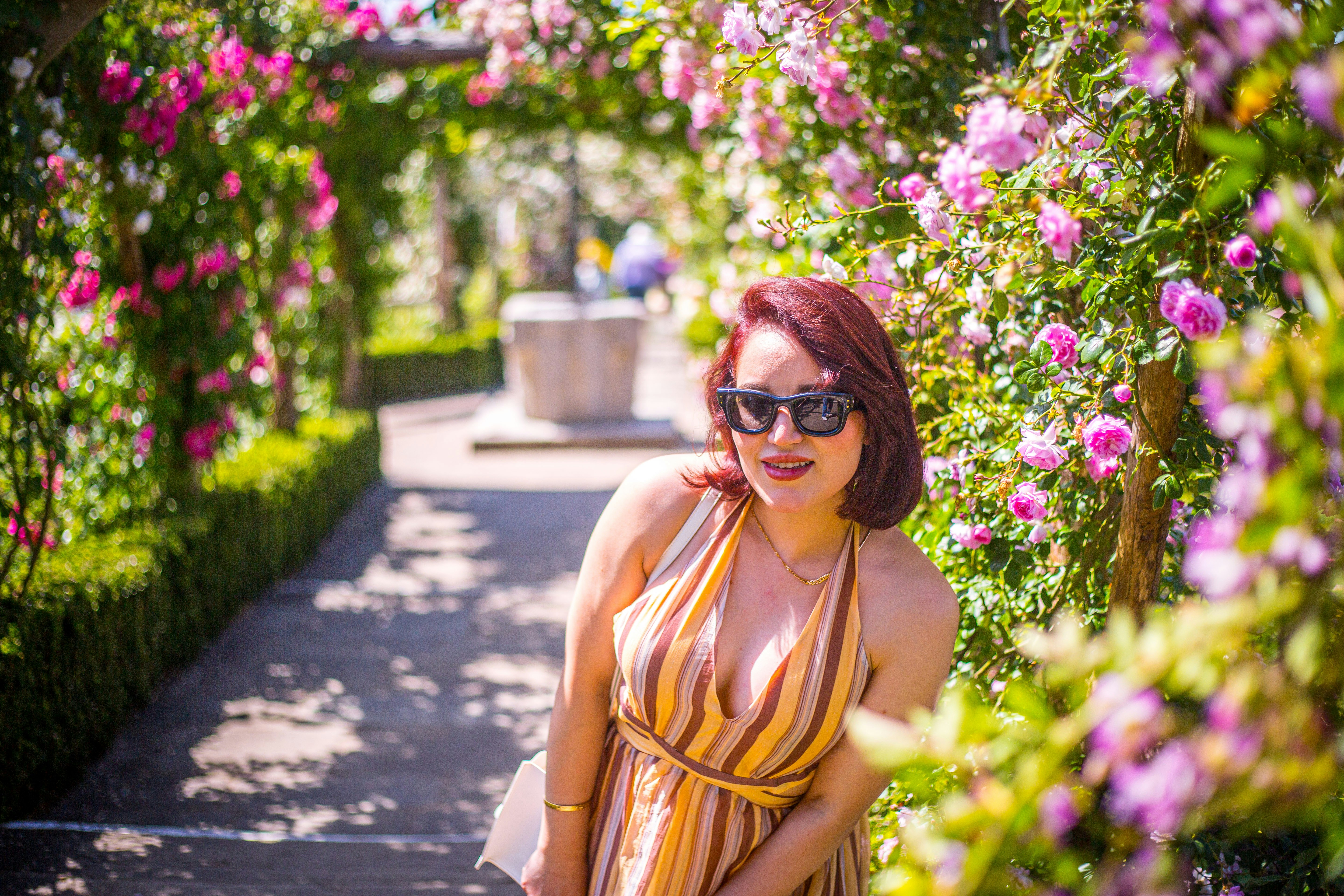 Sunlit Muse Amid Bougainvillea: A Summer Portrait