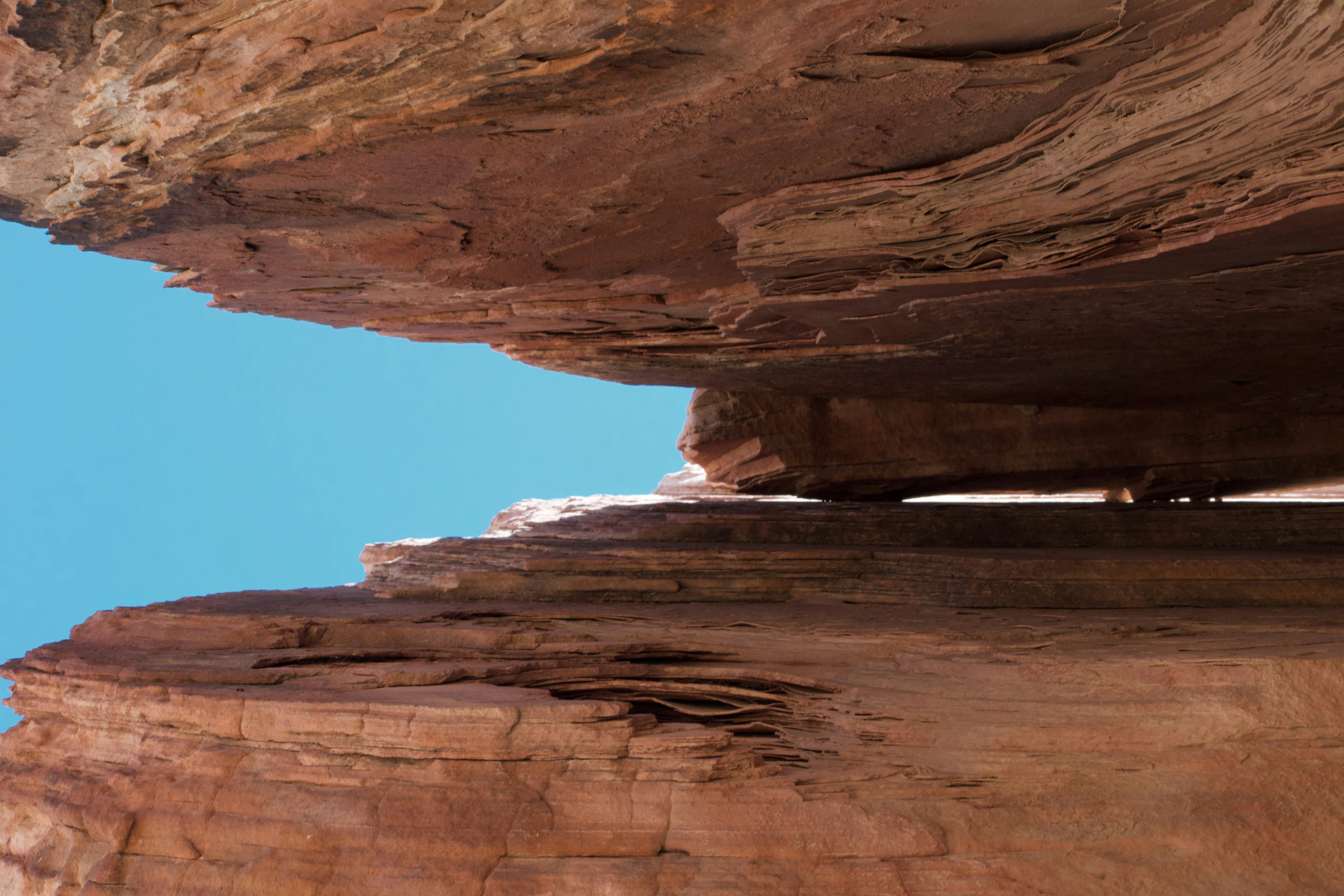 Overlook Between Strata: A Narrow Gap in Red Rock Armour