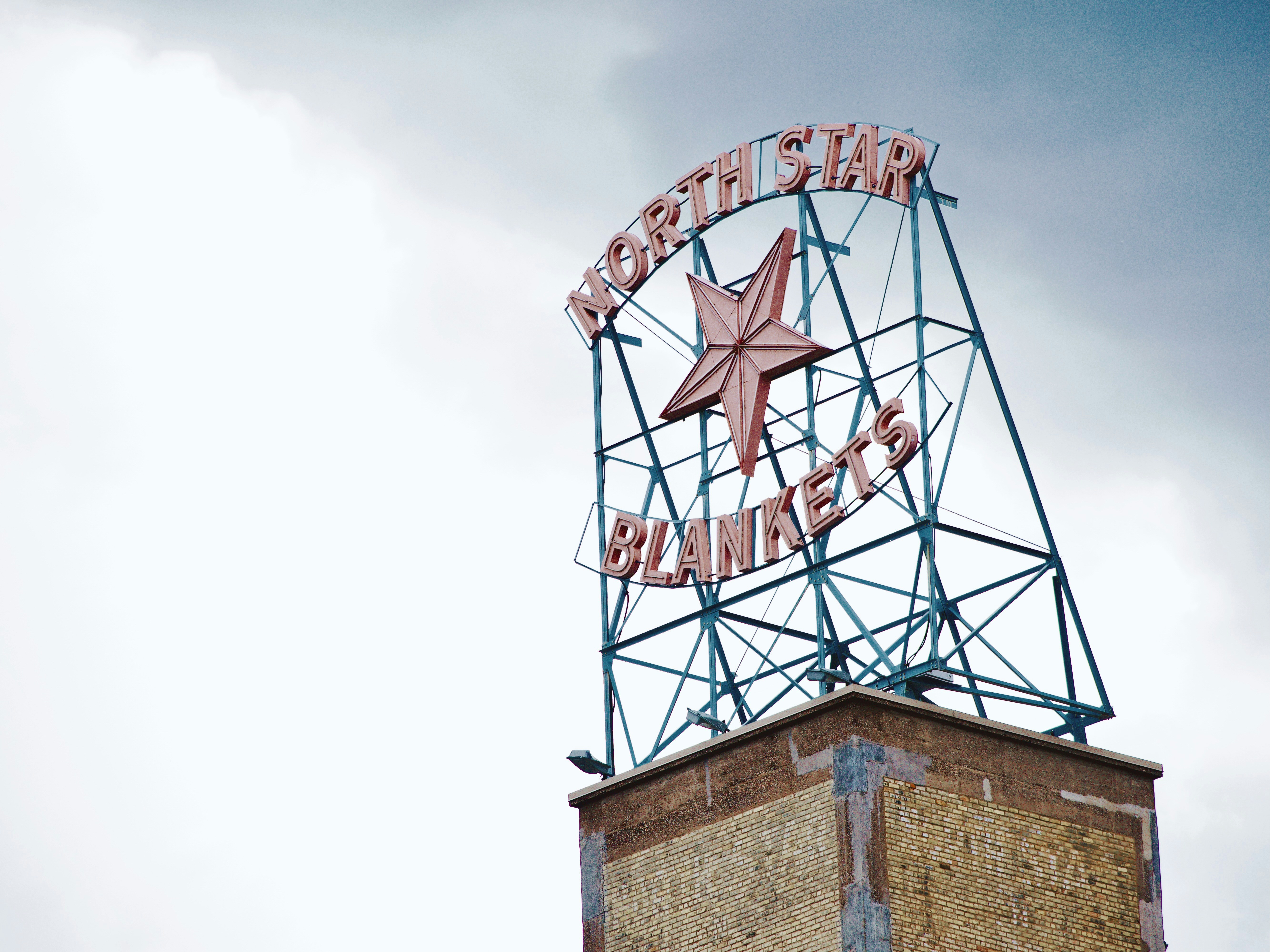 North Star Signage Rising Above Brickwork