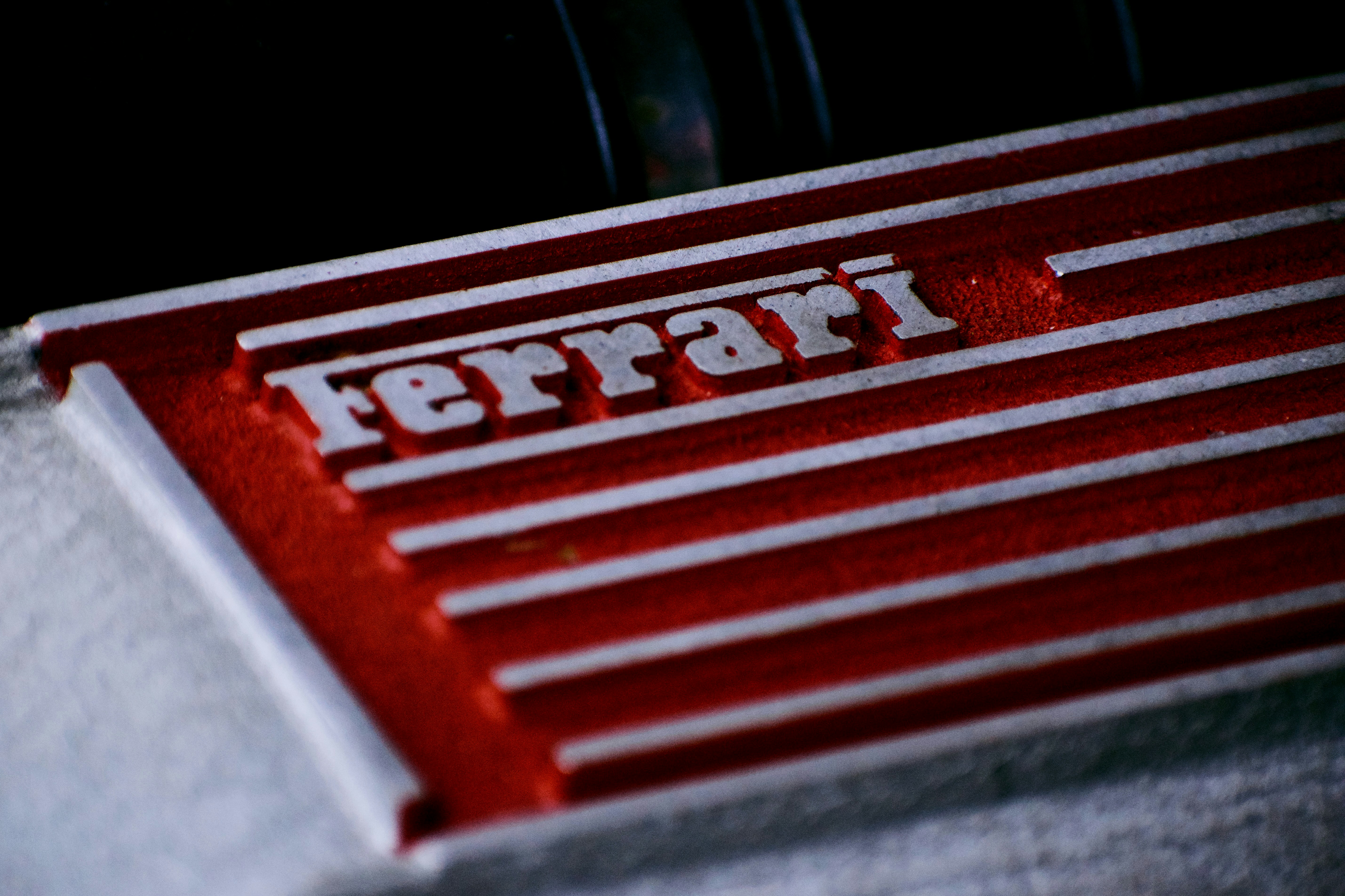 Redline of Precision: Ferrari Badge in Frost and Light
