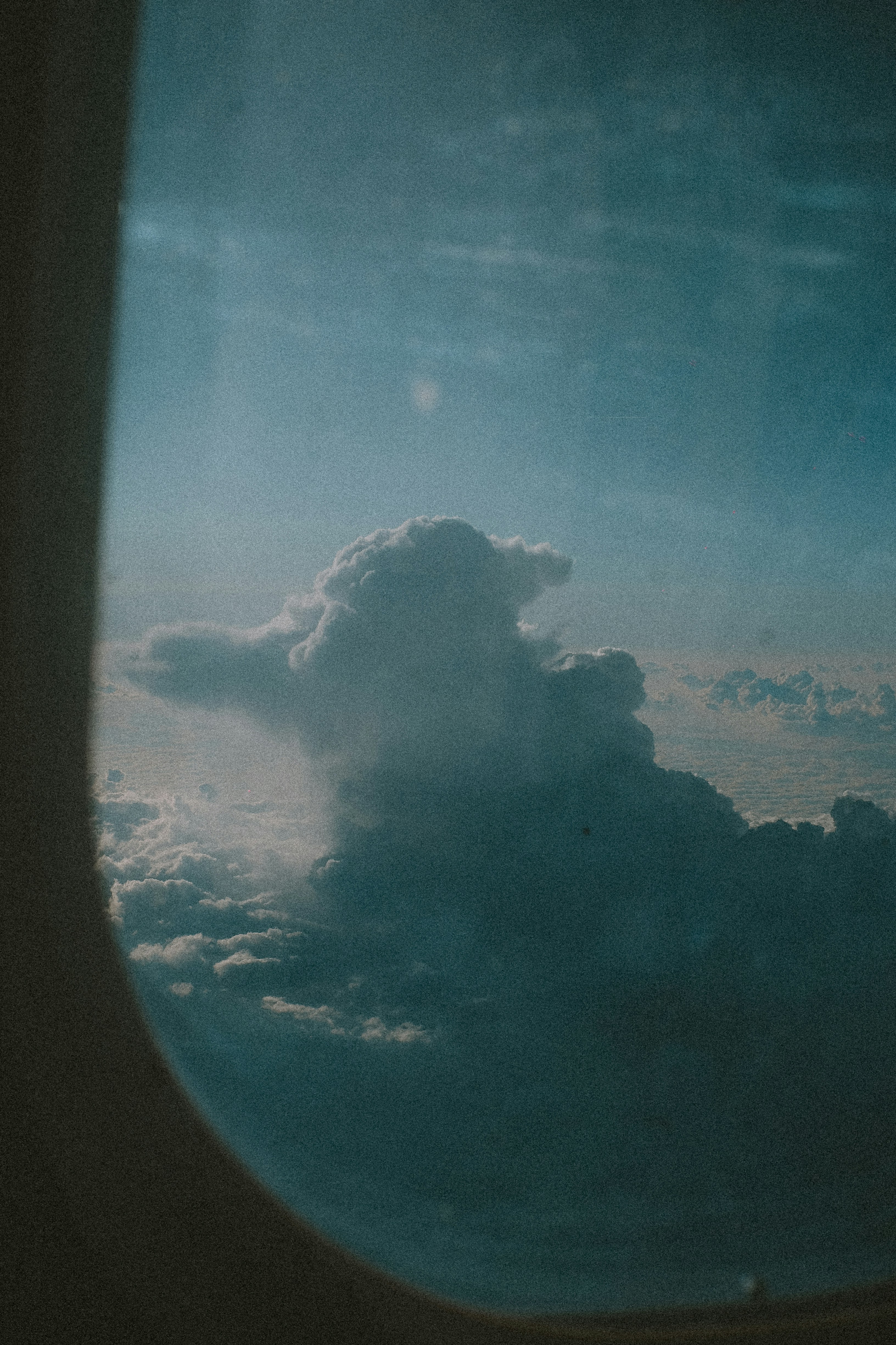 Cloudbound Window: A Flight Above Quiet Turquoise Skies