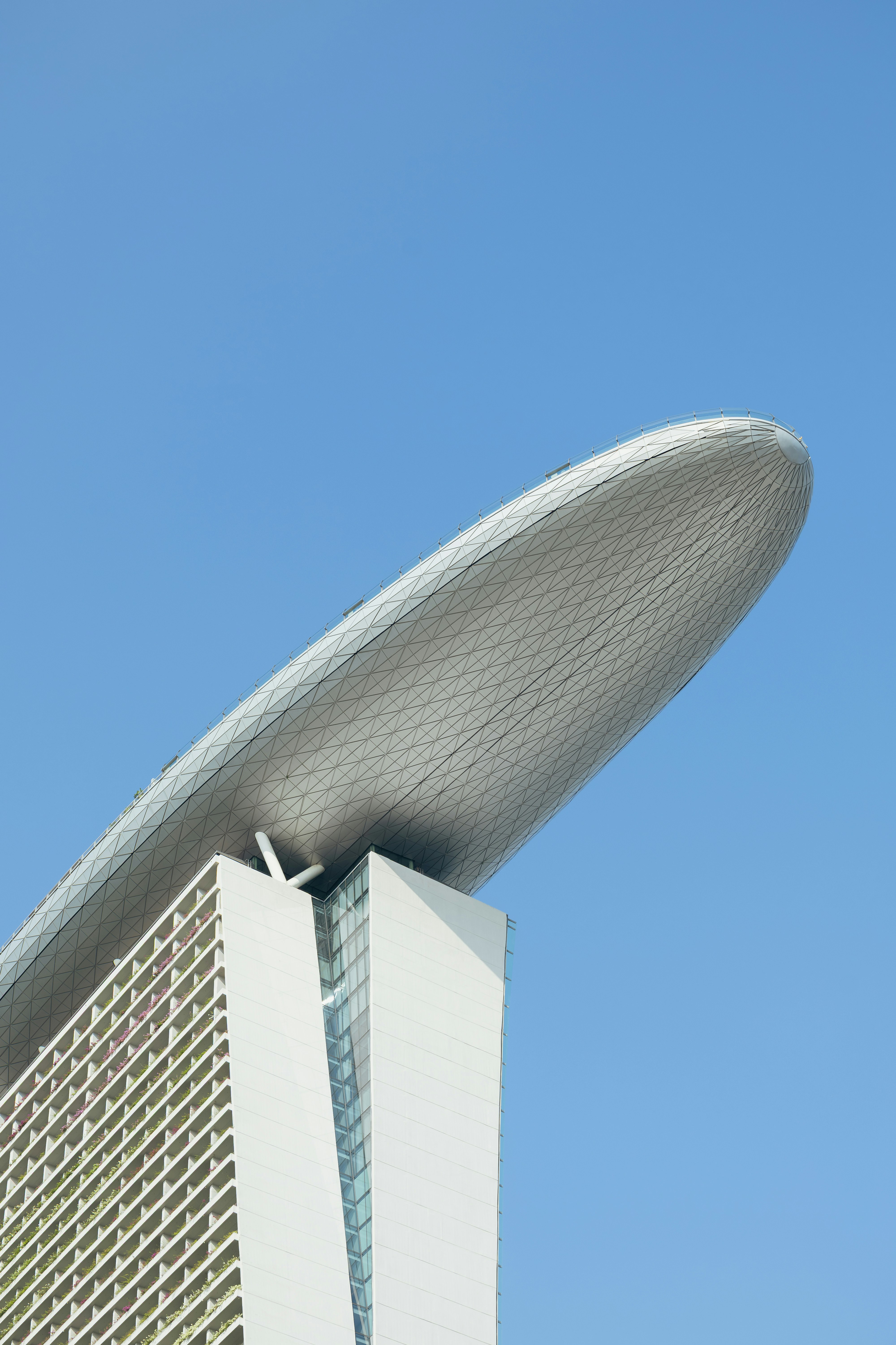 Winged silhouette: a futuristic tower crowned by a shard-like halo