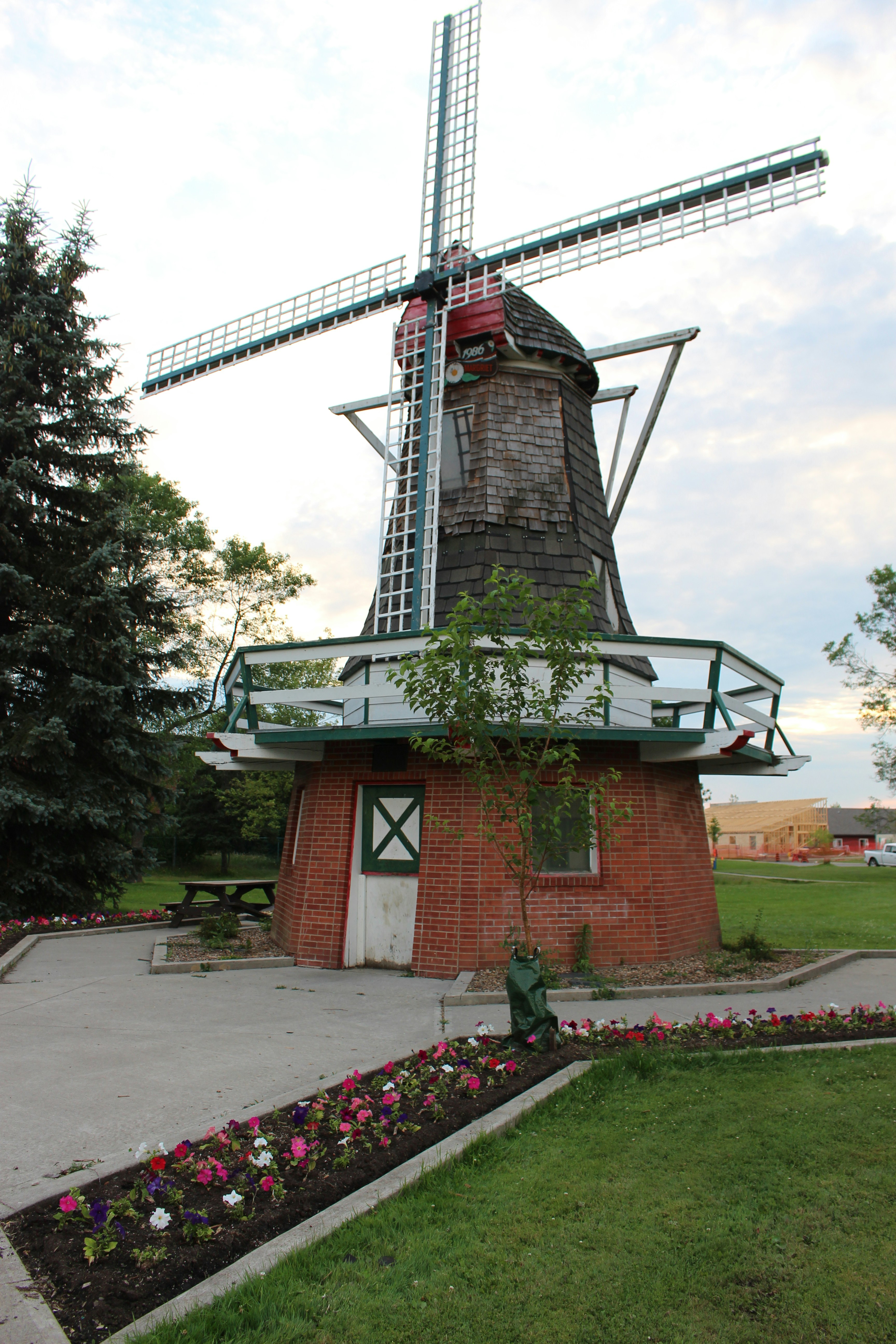 Windmill Beacon Over Green Courtyard