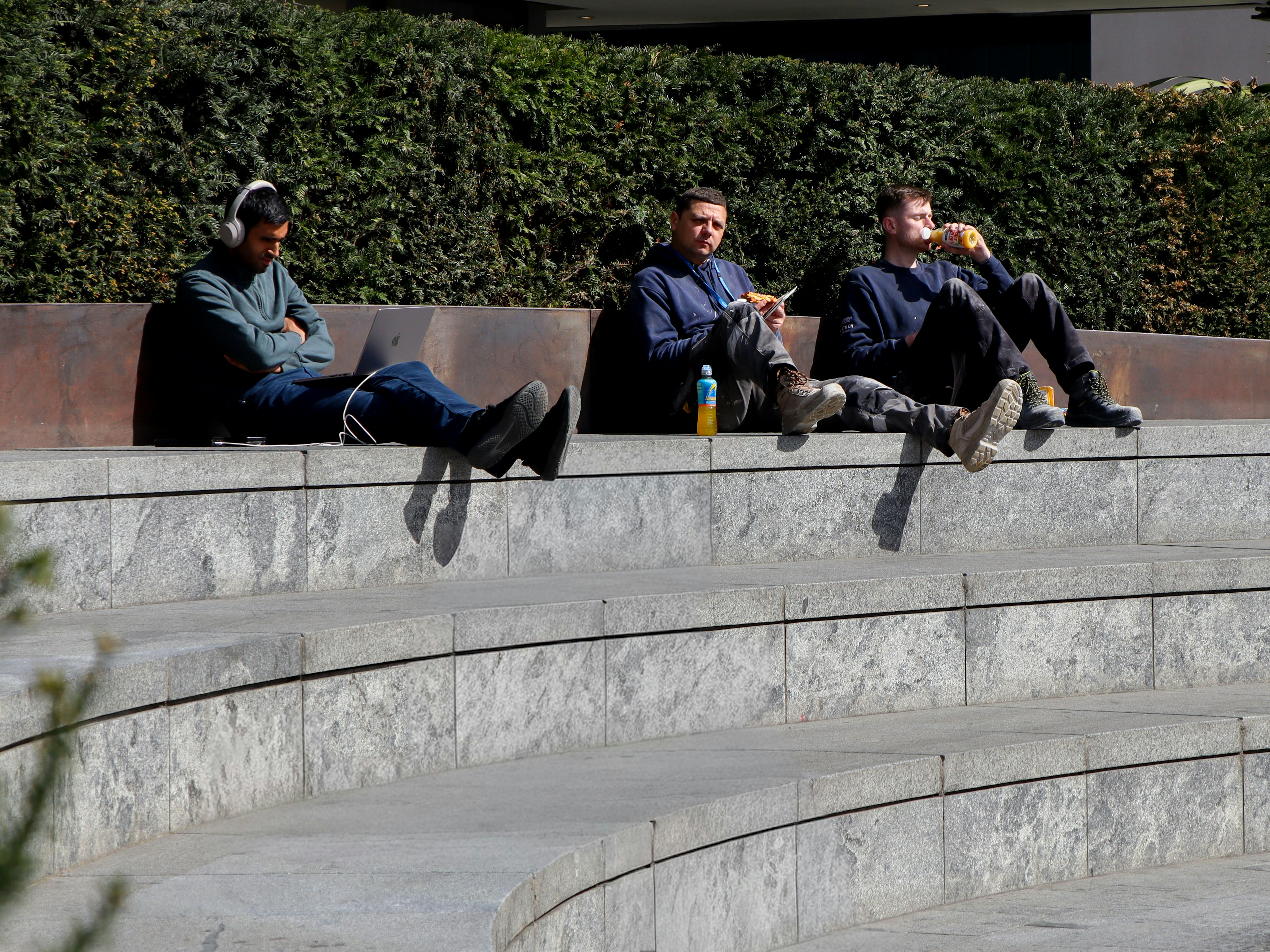 Three Exiles on Concrete Steps