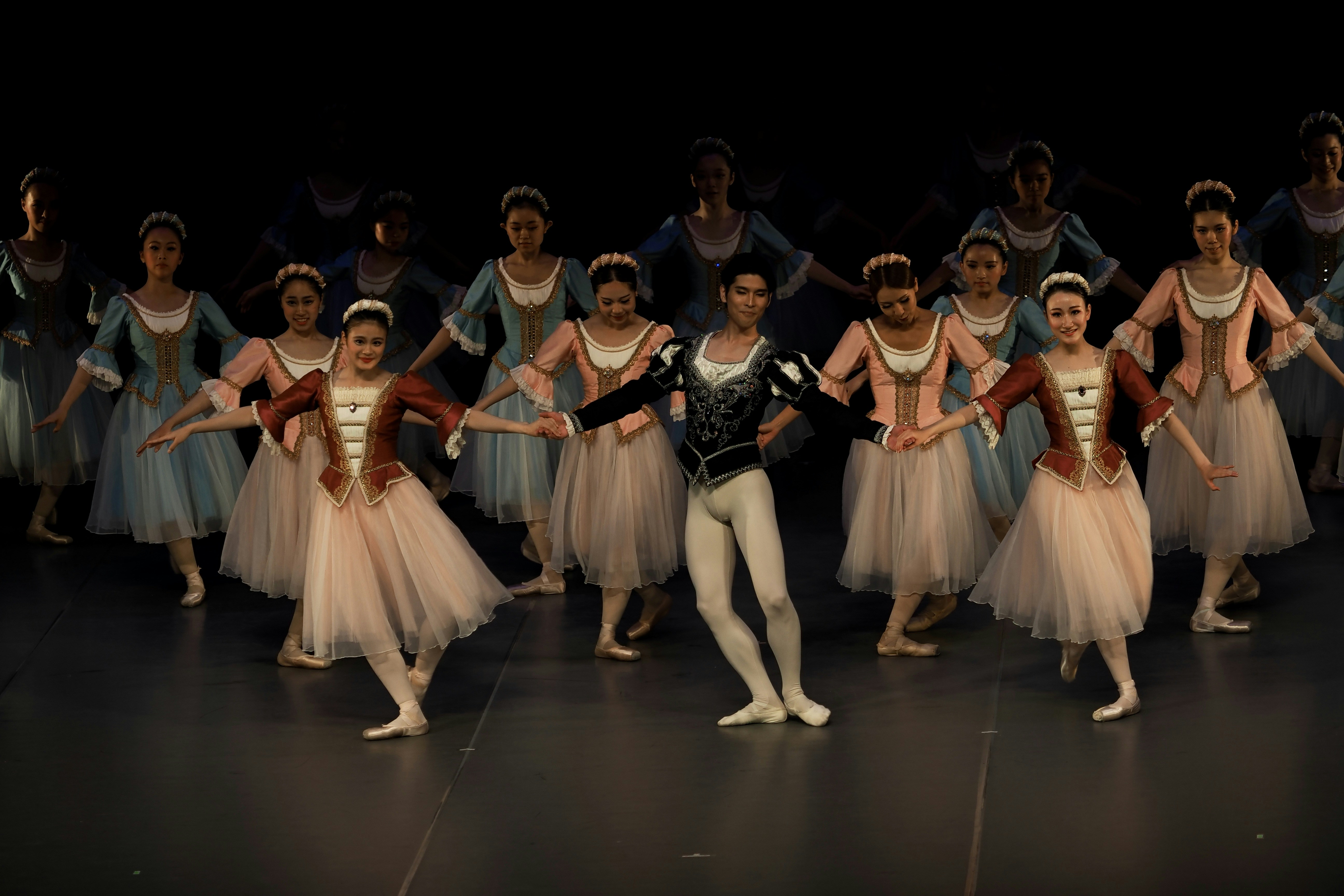 Center Stage Ballet Ensemble: A Graceful Pose Under Spotlight