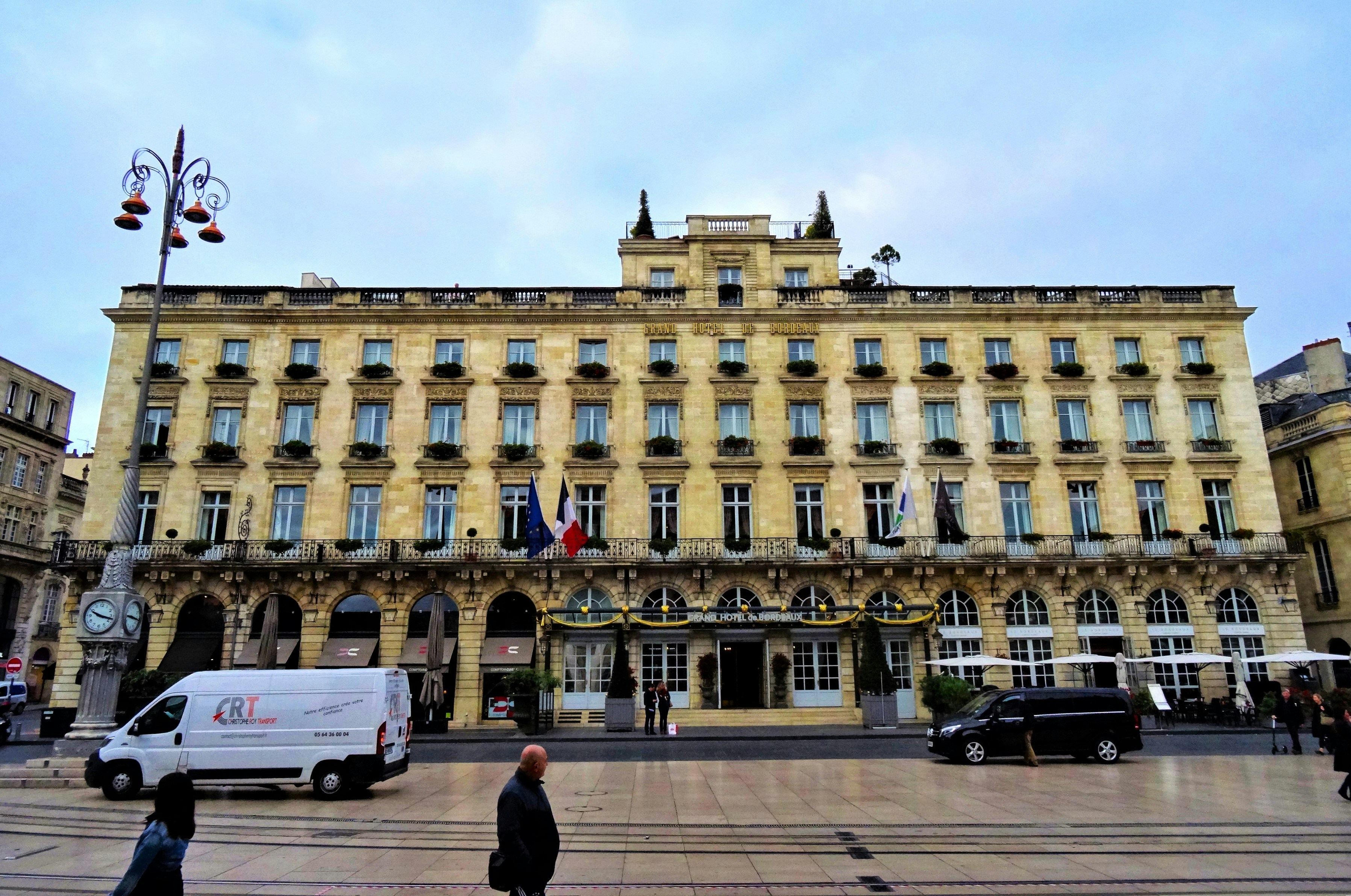 Timber-and-stone Facade: City Hall Across the Tram Tracks