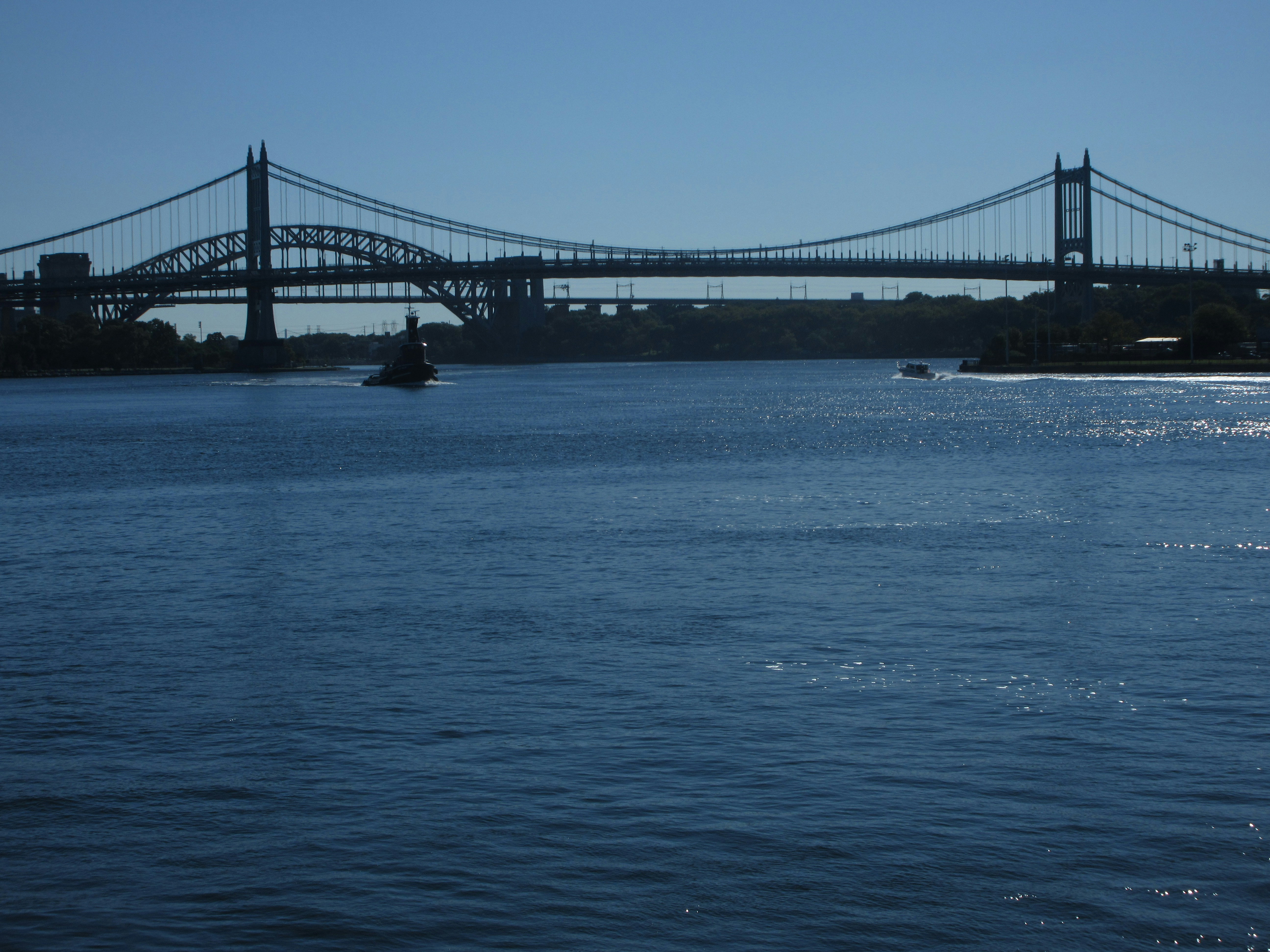 Blue Hour Skyline: Suspended Grace Over the River