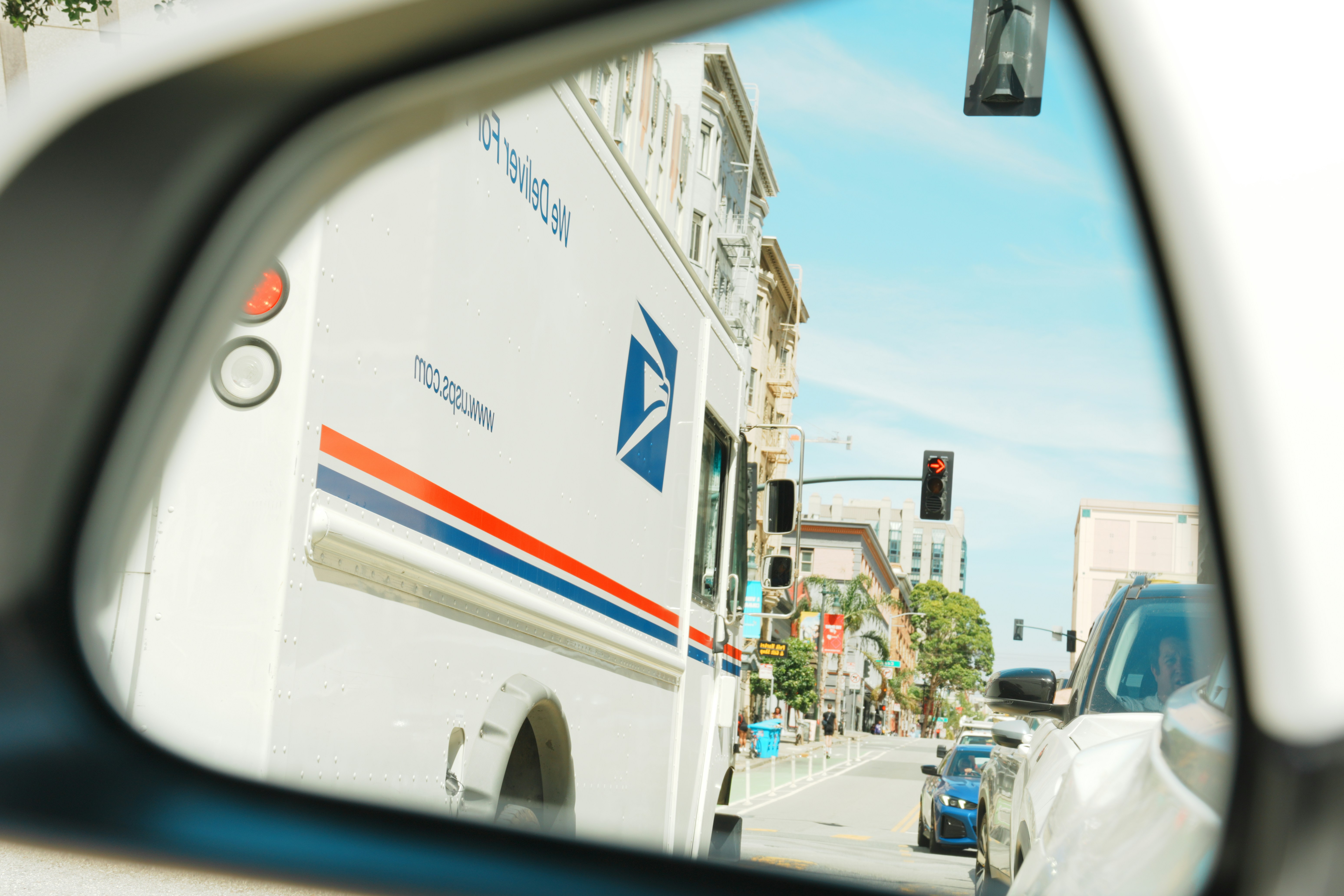 Rear-View Metro: A Delicate Moment Beyond the Side Mirror