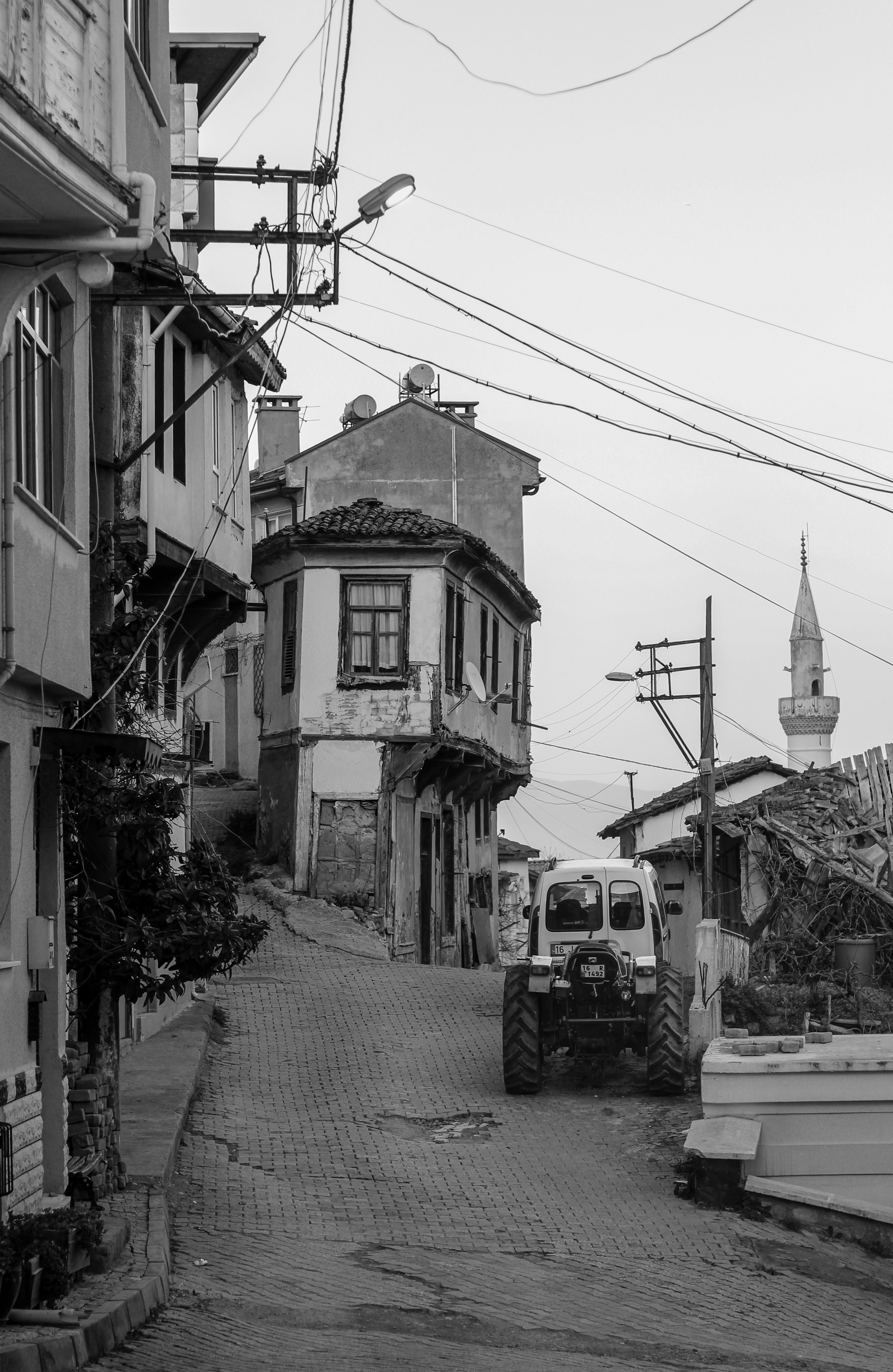 A Narrow Cobblestone Street Framed by Timeworn Buildings