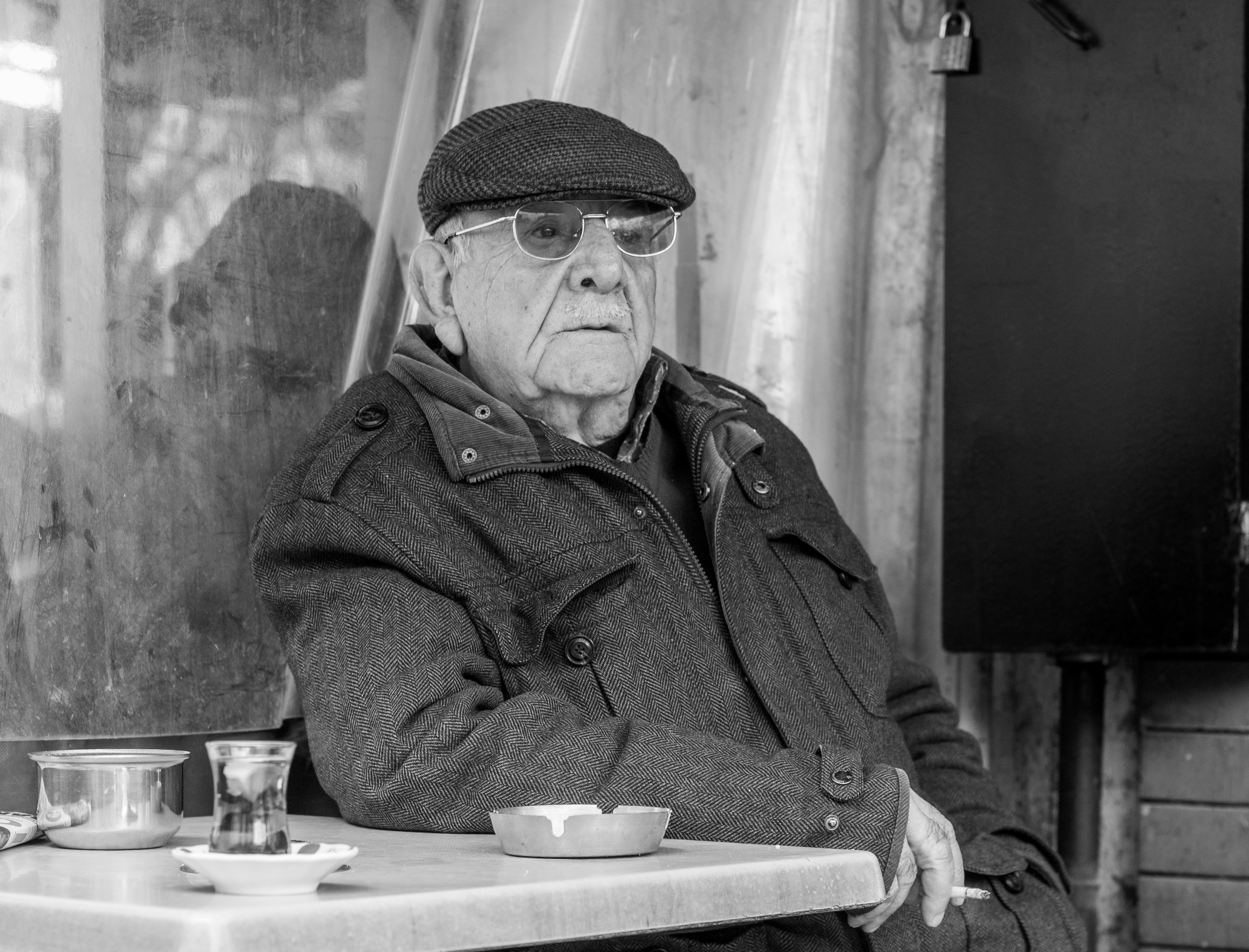 Quiet Patron in a Weathered Corner