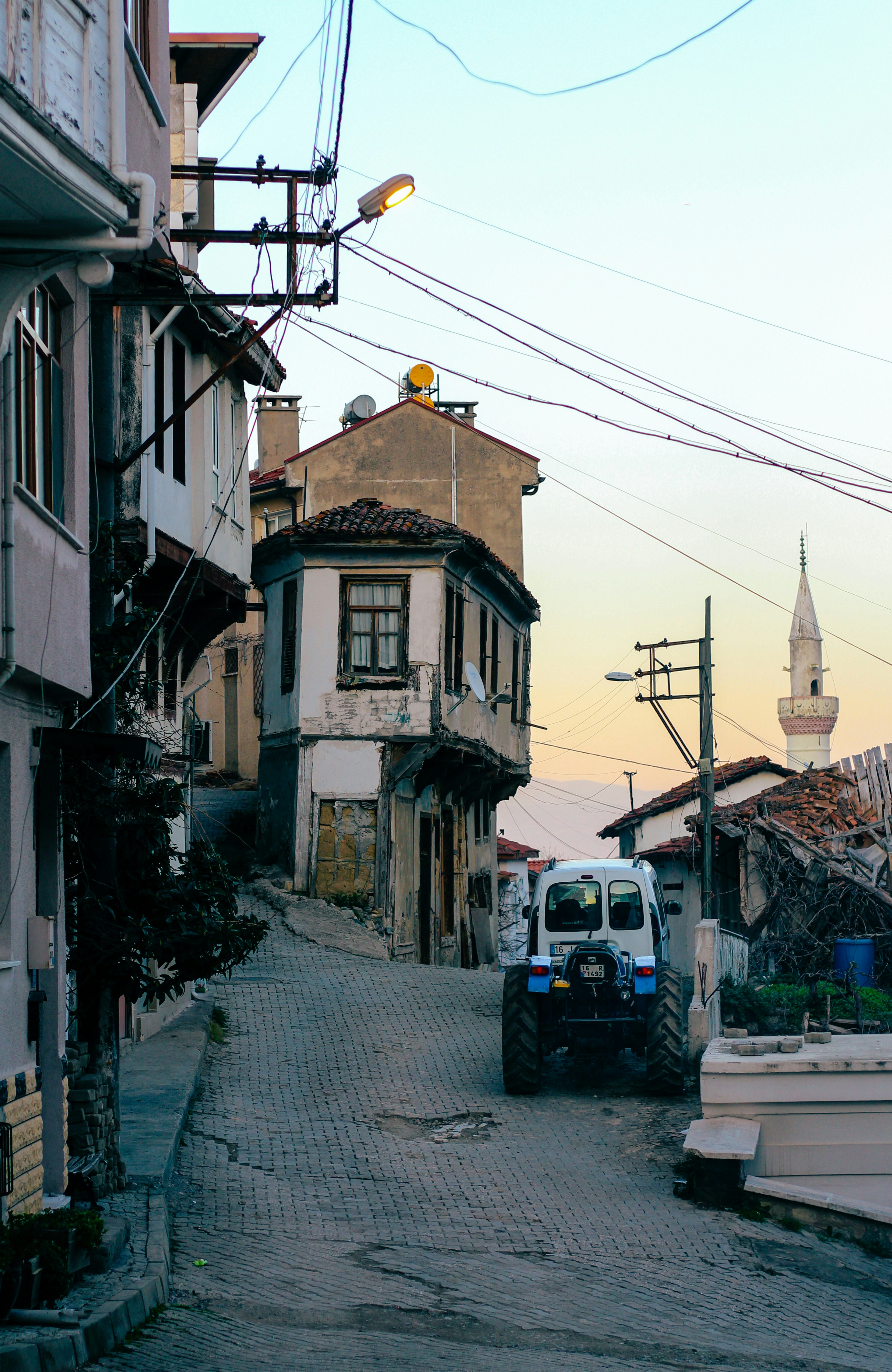 Steep cobblestones, a tiny tractor, and a sunset skyline