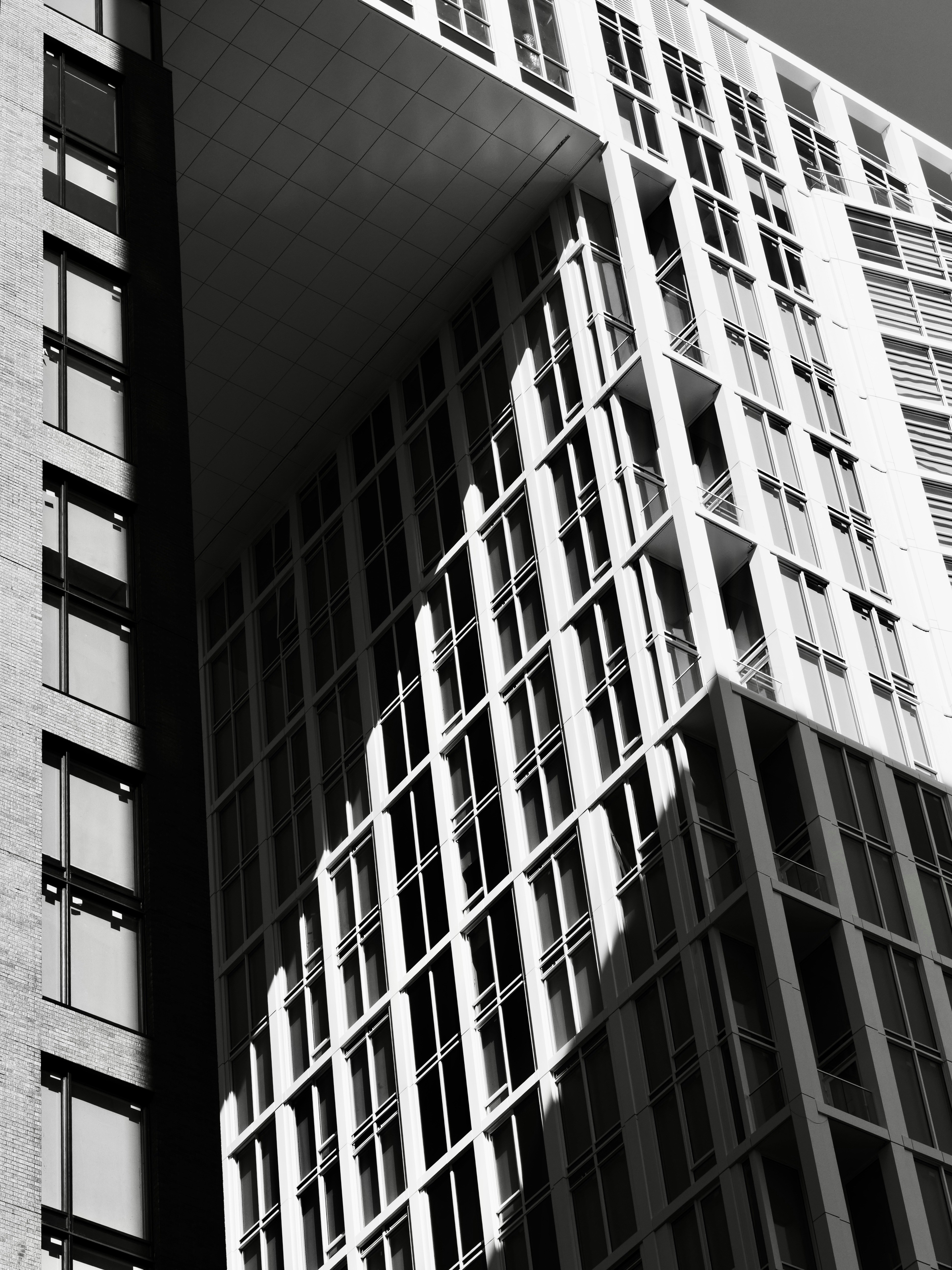 Crystalline Facade: Shadow Lines on a Modern Architecture