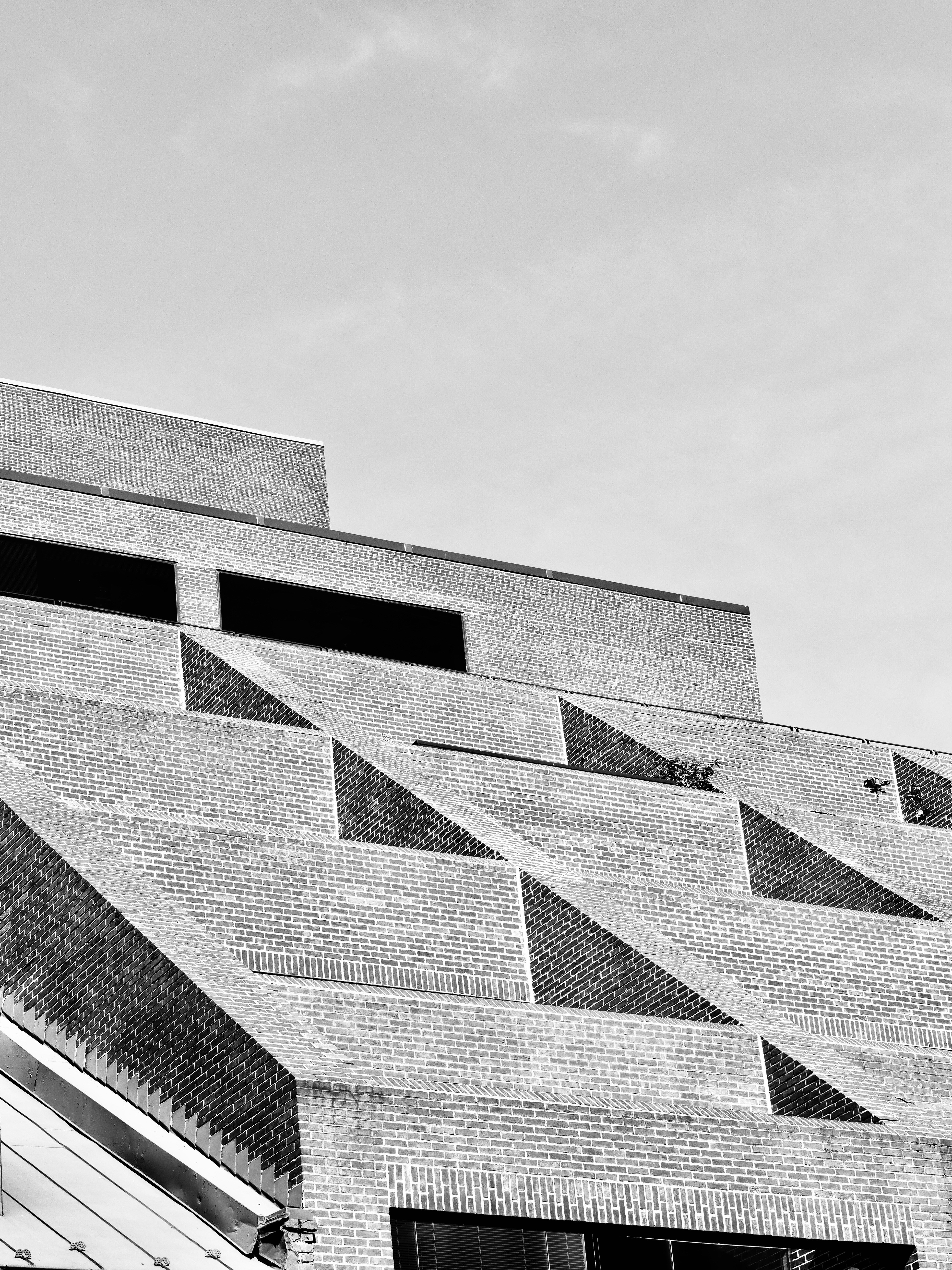 Geometric Facade: Stair-stepped Brickwork against Open Sky