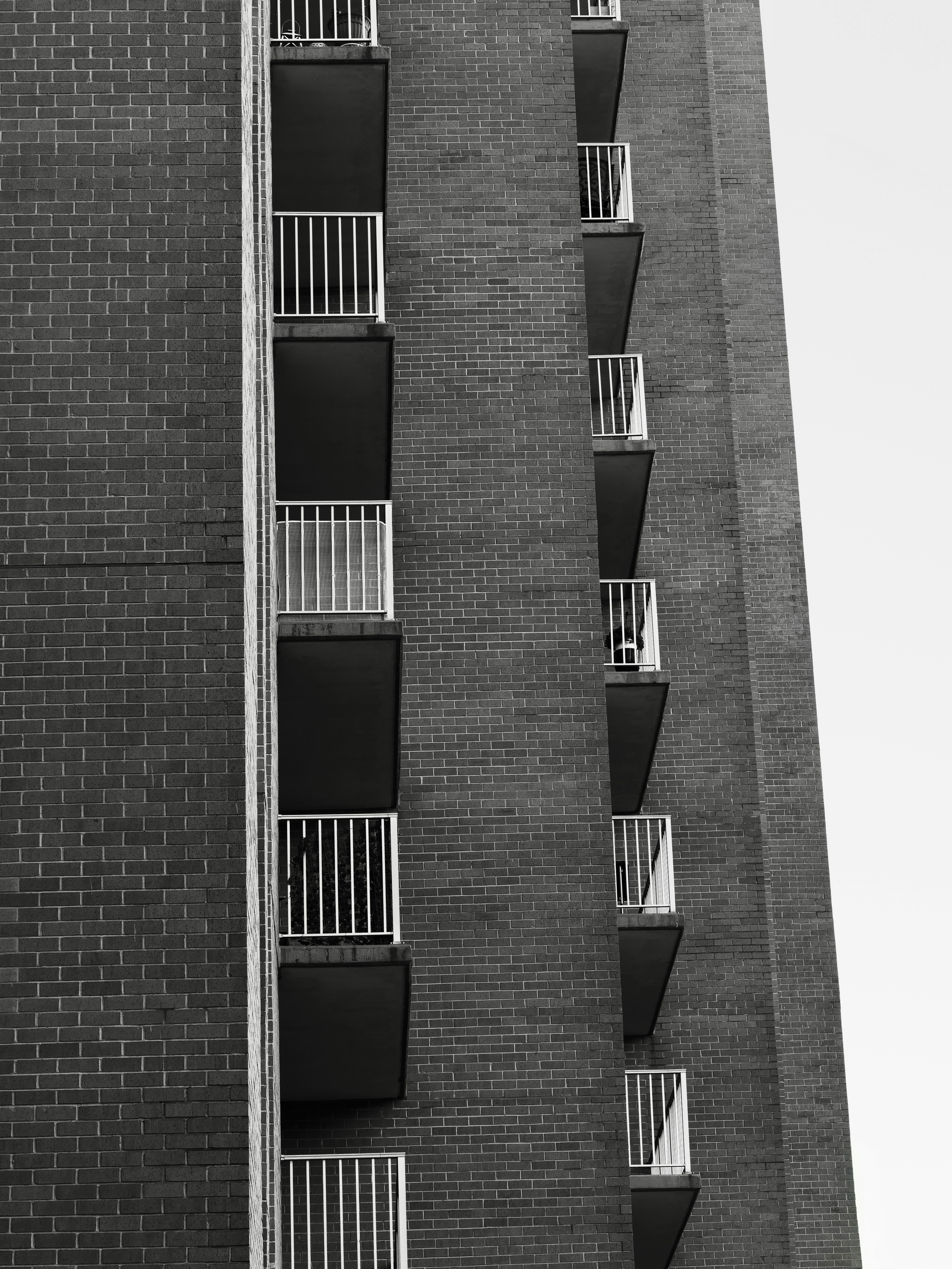 Vertical Rhythm: Brick Facade and Repeating Balcony Antiphony