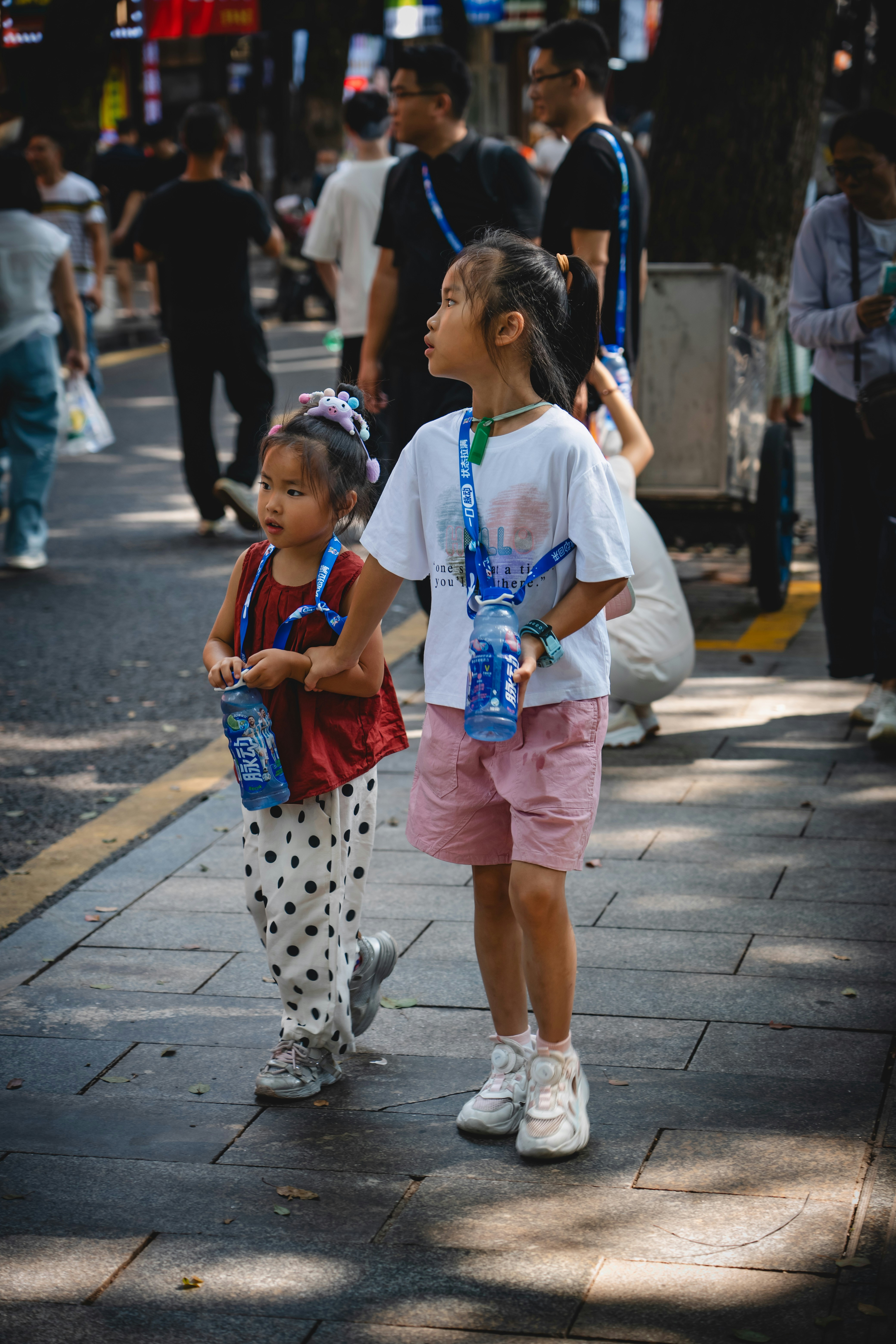 Two Young Explorers in a Bustling Street Scene
