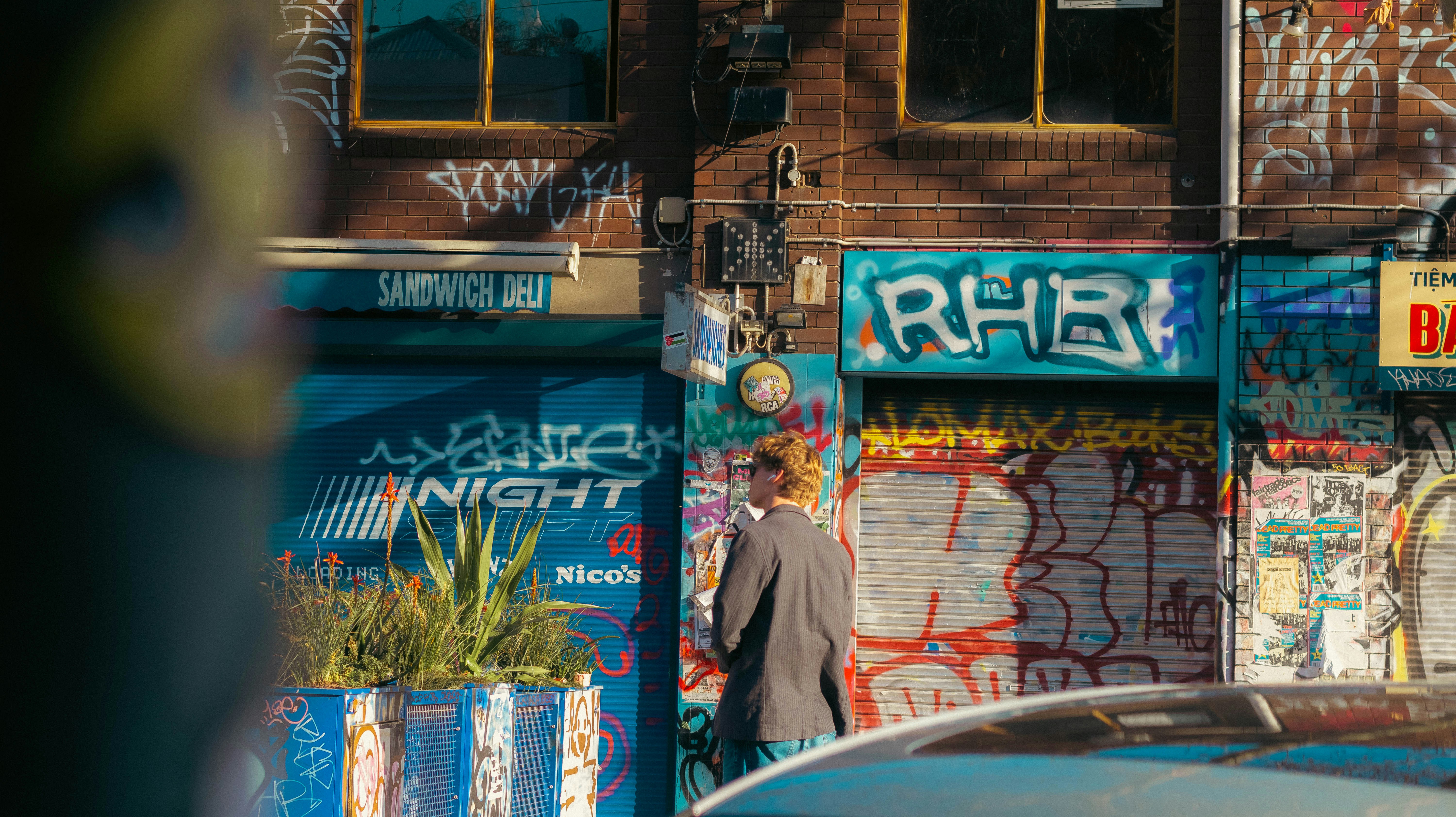 Graffiti Alley Portrait: A Street Scene with Hidden Observer