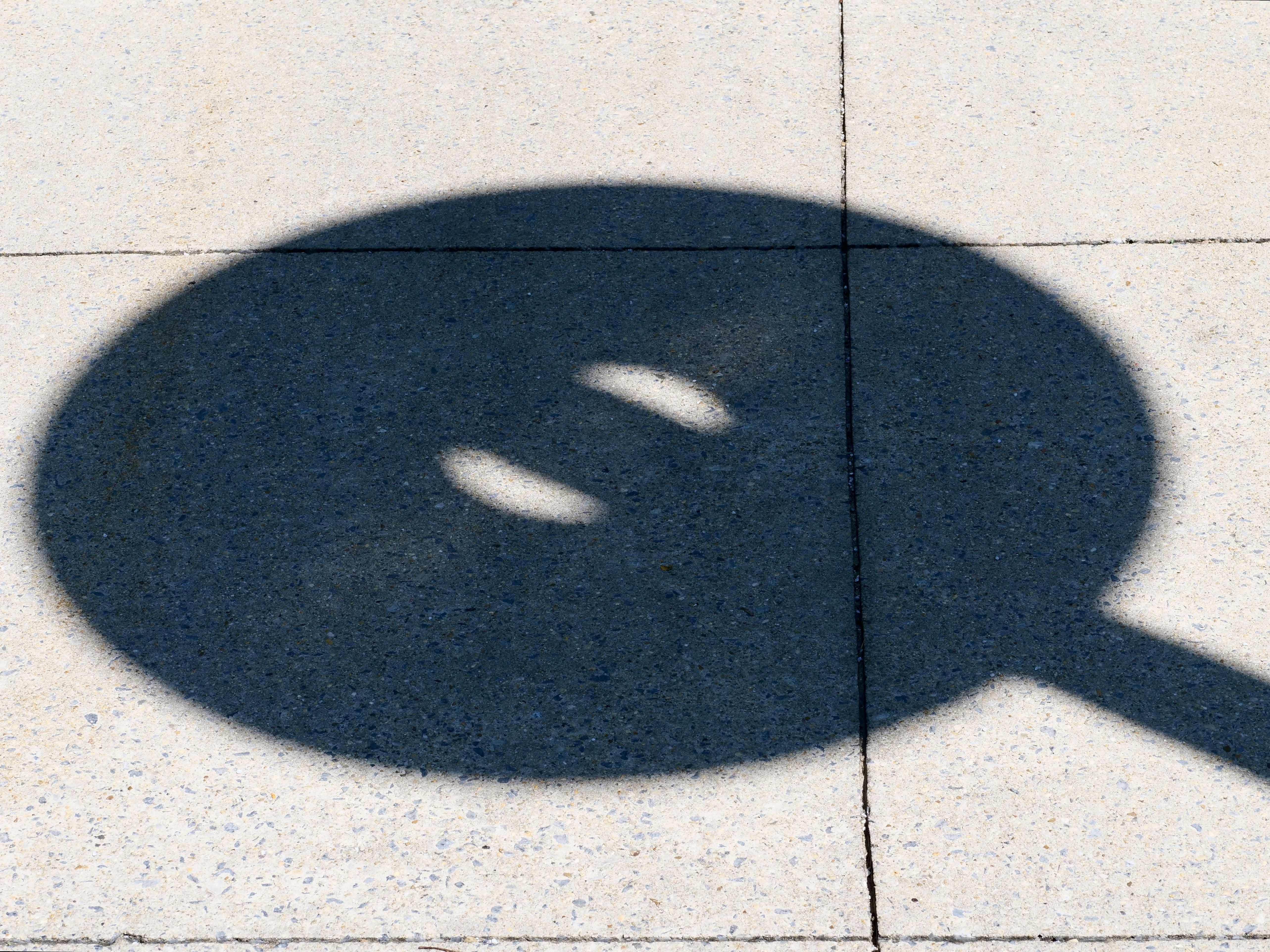 Shadow Spotlight: A Circular Tap on Concrete