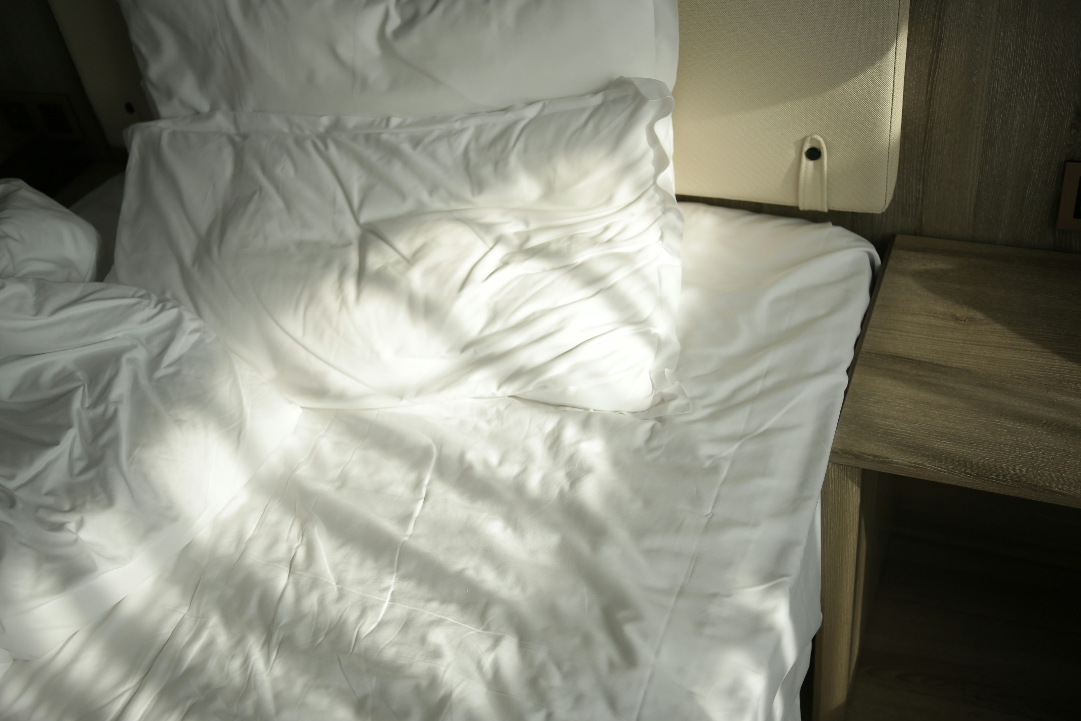 Untidy Bed in a Modern Cabin