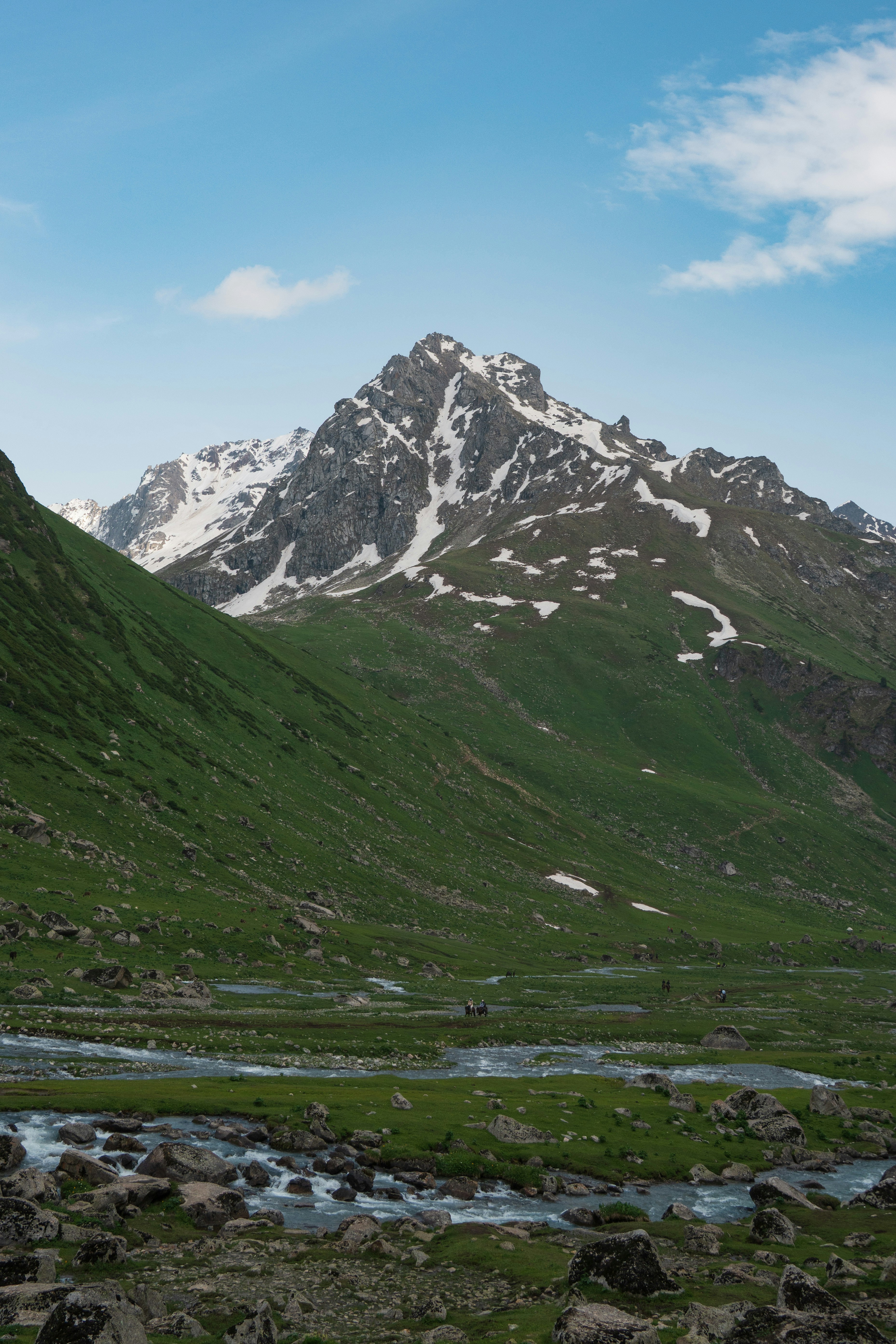 Snowcrowned Peak Over the Alpine River Valley