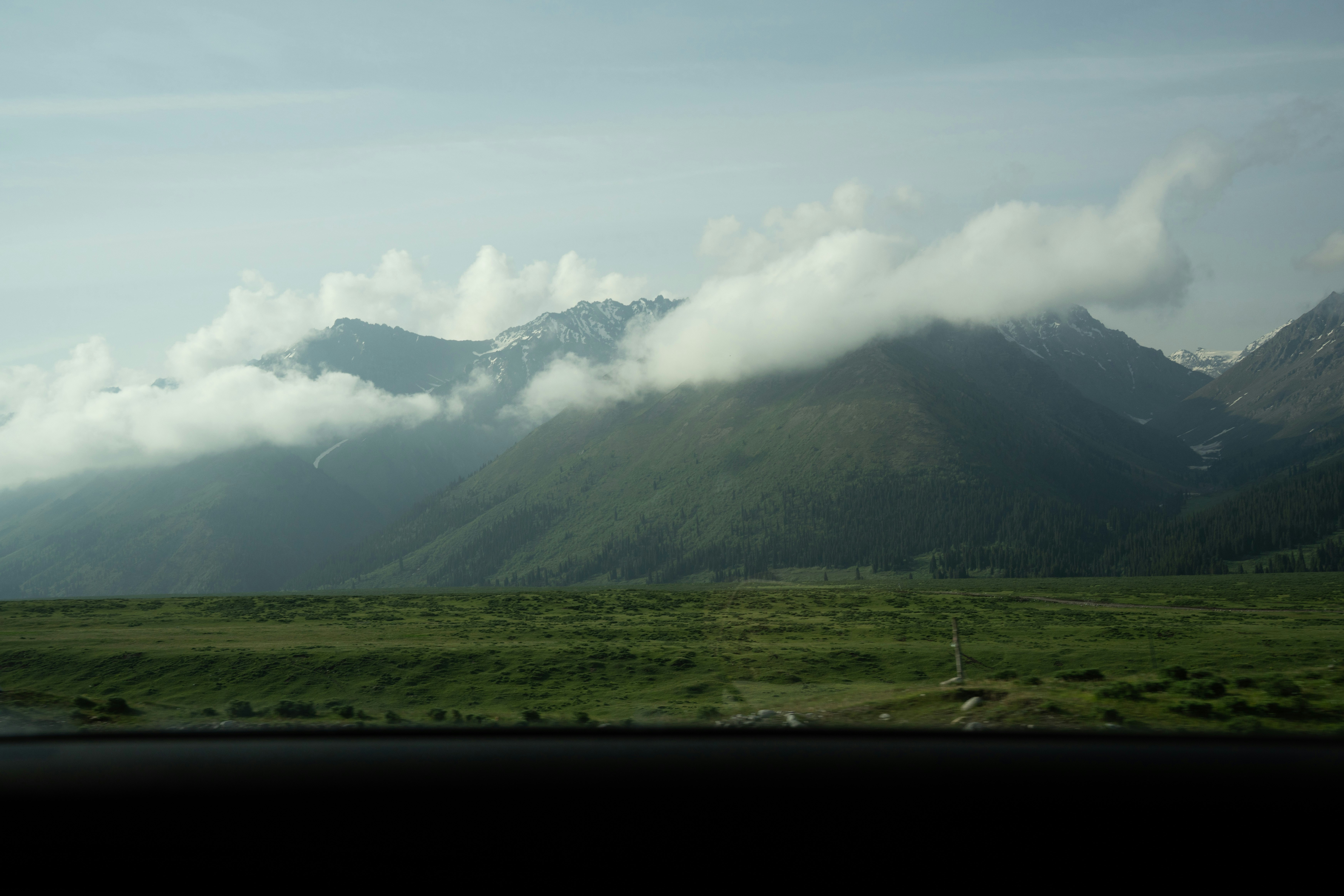 Mist-Softened Ridge: Alpine Horizon Over a Rolling Valley