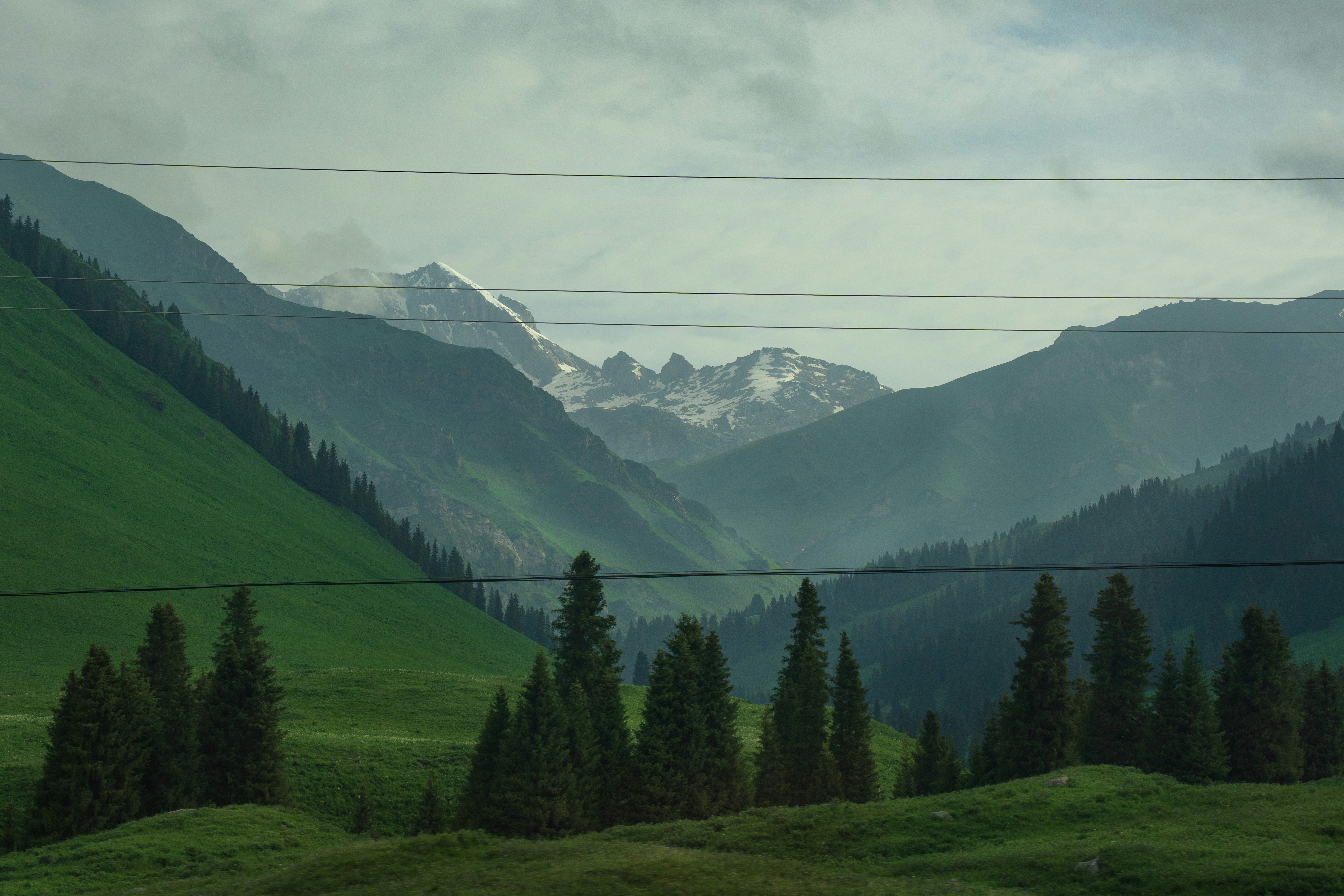 Valley Ridge Under Snow-Capped Crest