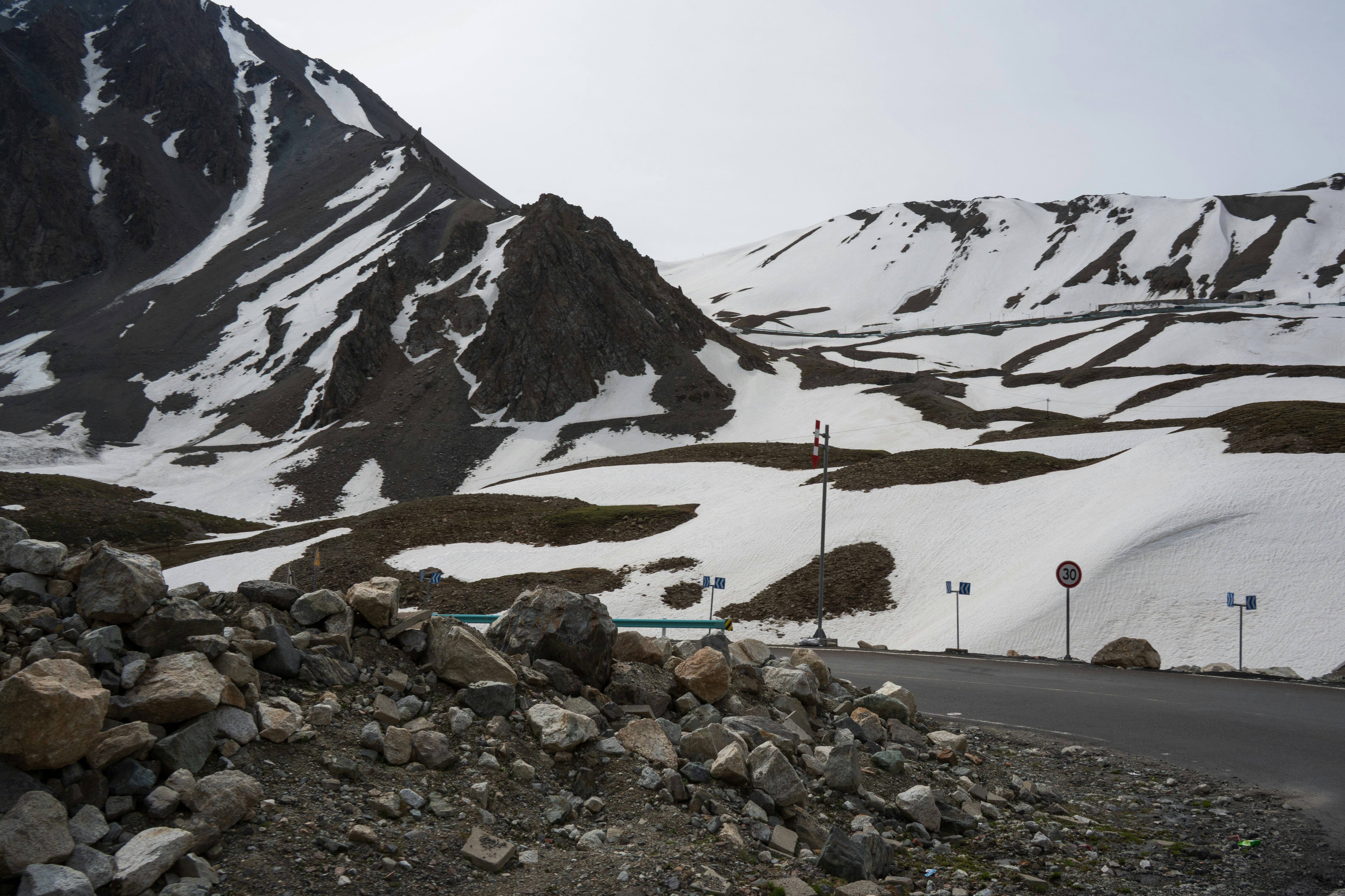 Snow-veiled Peaks Meet the Quiet Rock-Strewn Descent
