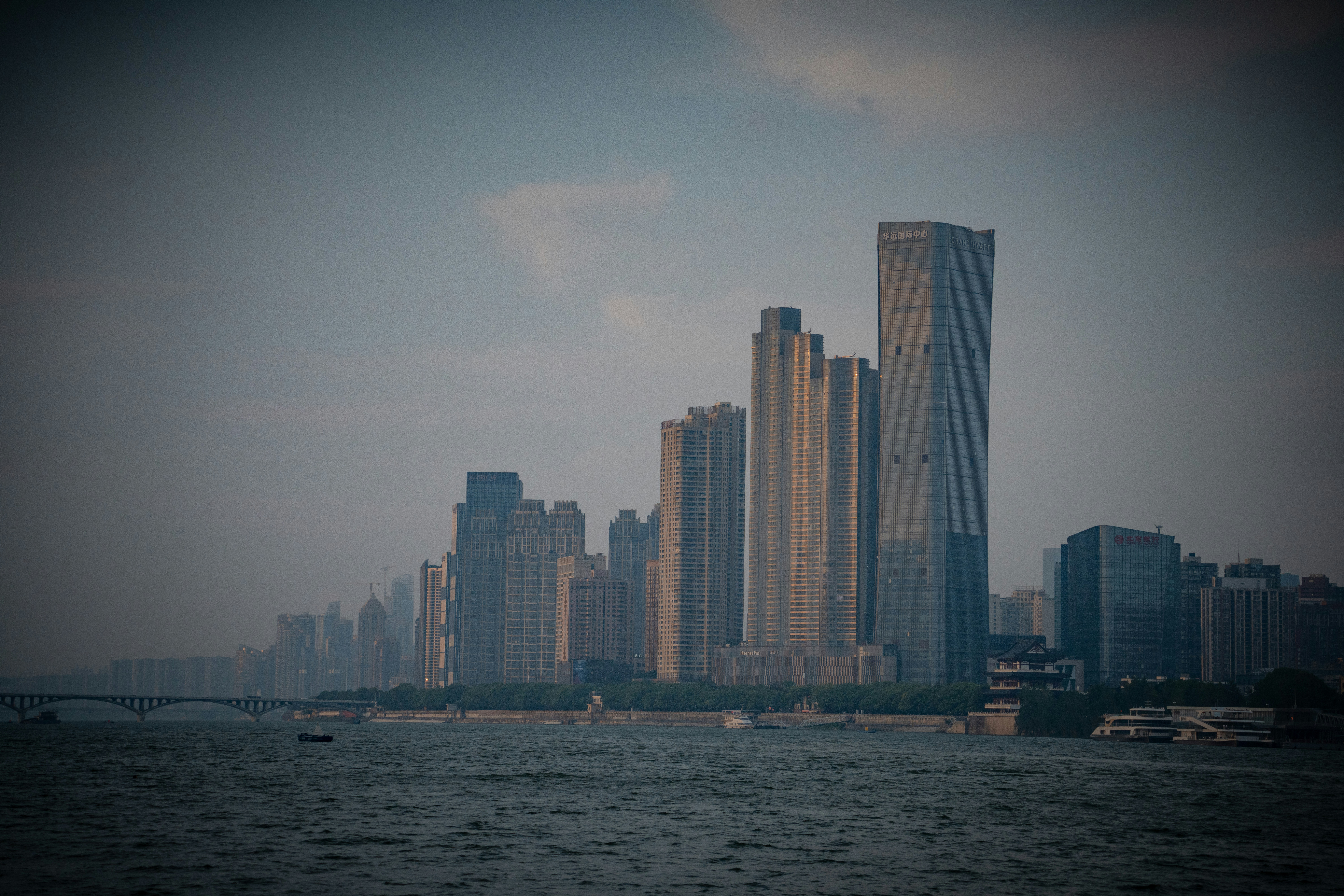 Urban Silhouette over Calm Waters at Dusk
