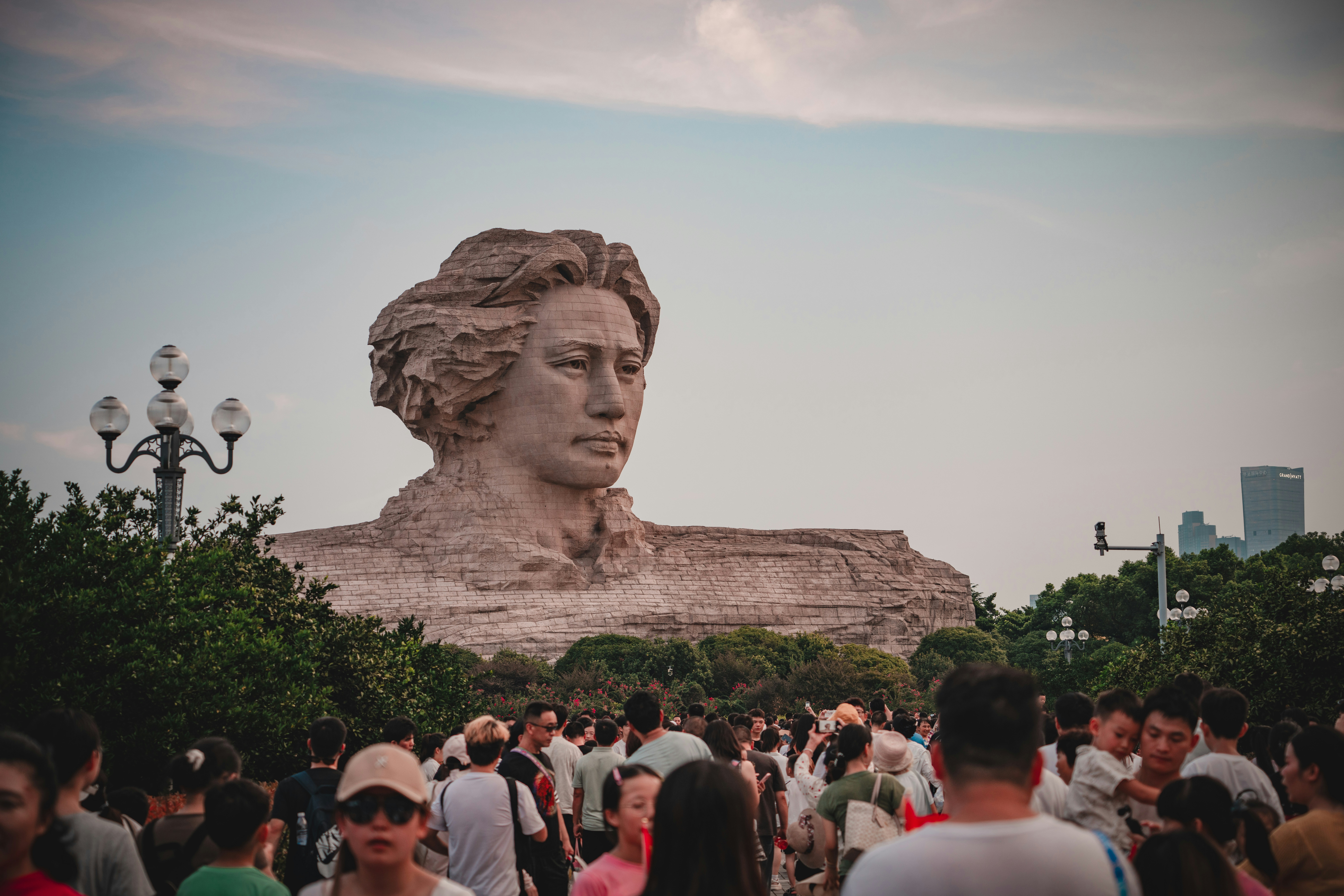 Stone Portrait Overlooking a Sea of Faces