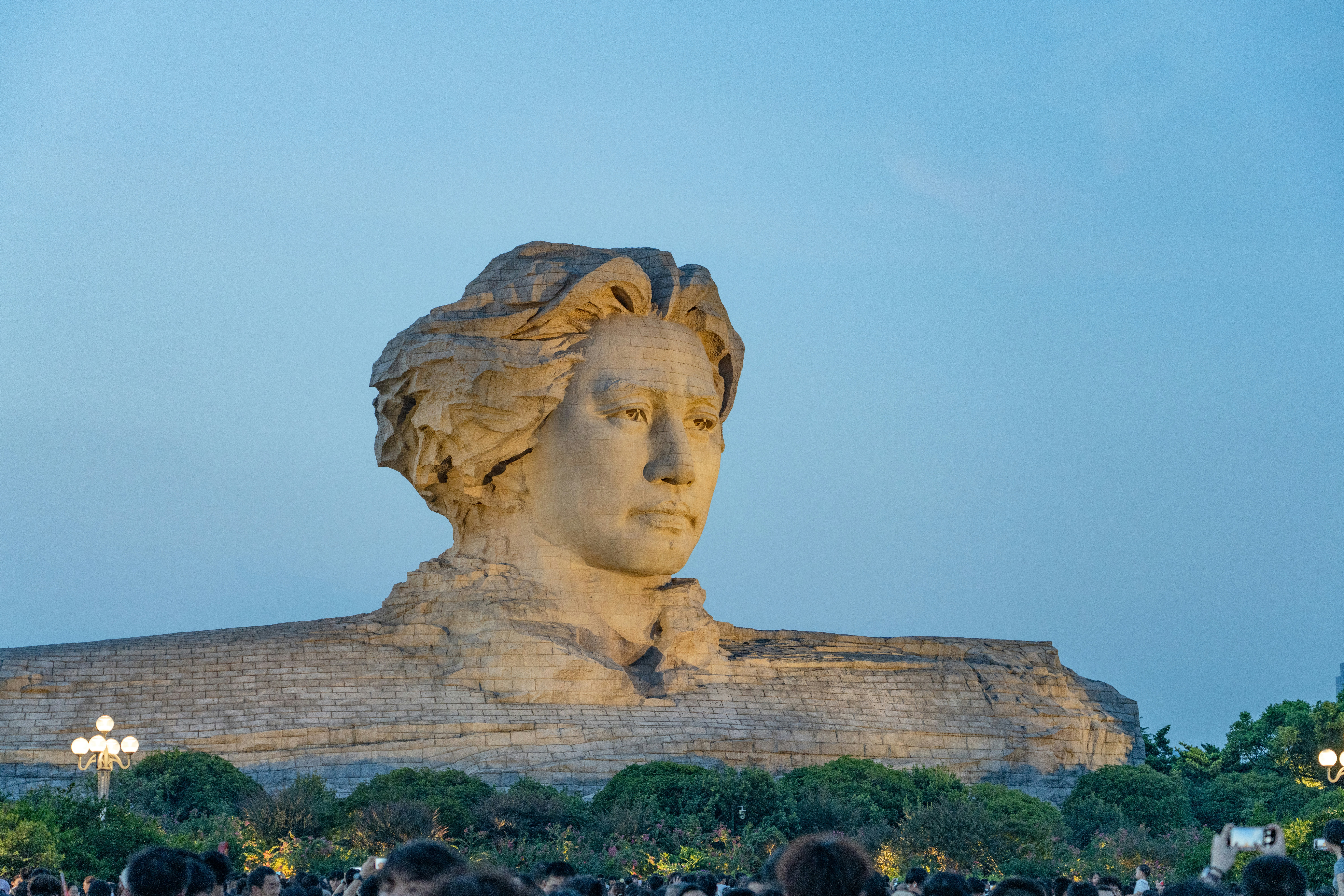 Stone Sentinel: The Mao Zedong Memorial Giant's Head Rising from Green