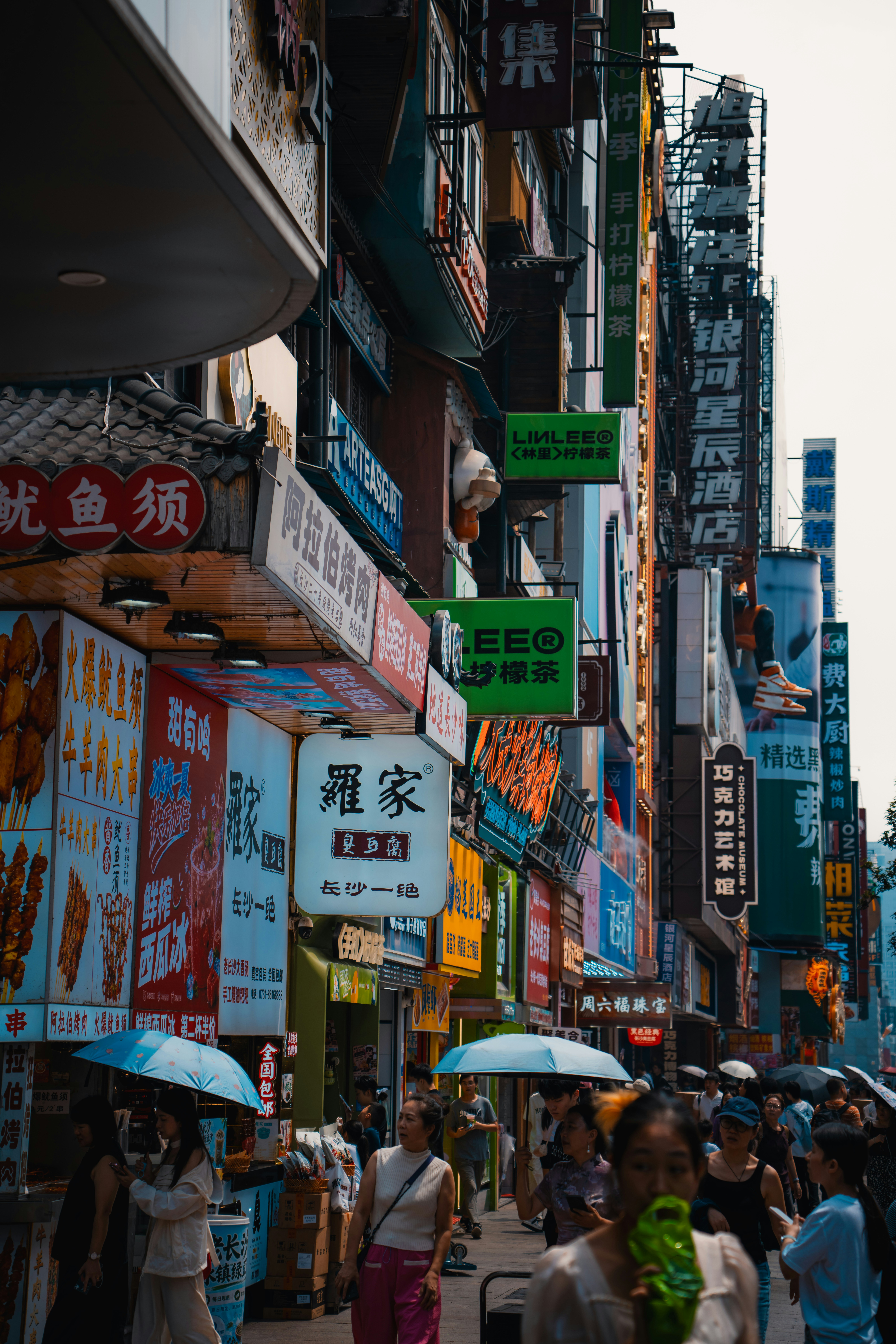 Neon Alleyways: A Bustle of Signs and Shoppers in a Chinese Market